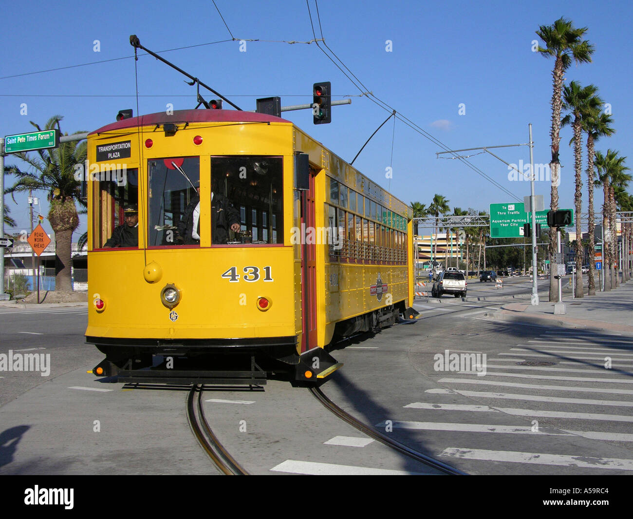 Sign showing a cross street and railroad tracks for railroad train ...