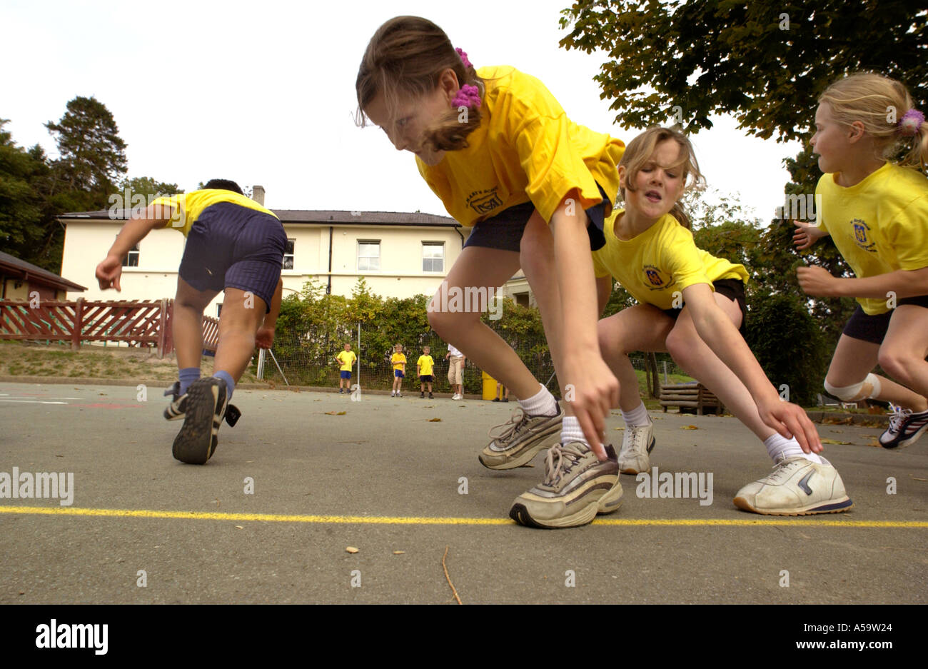 Primary pupils doing a physical sports task and log the results into ...