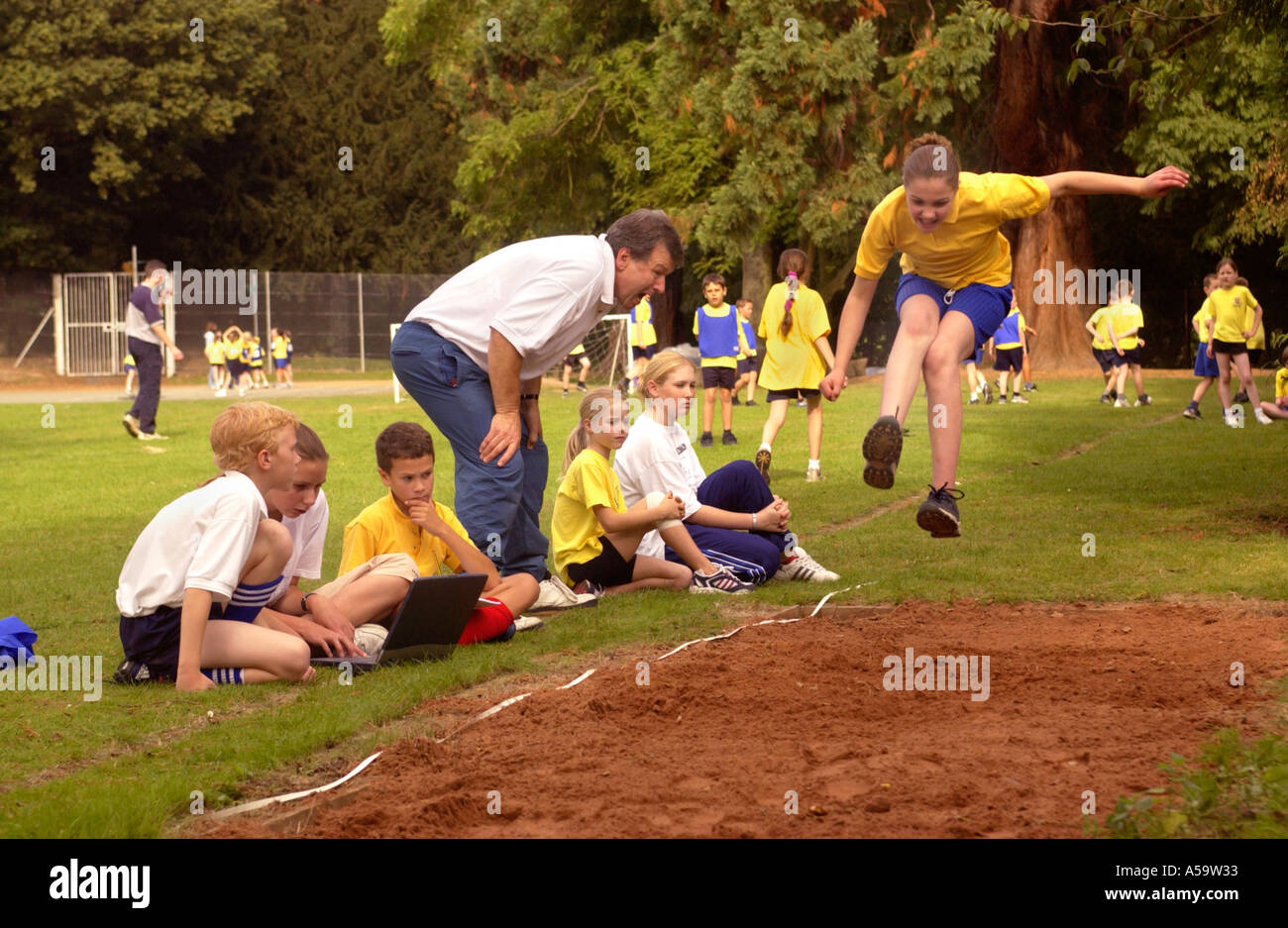 Primary pupils doing a physical sports task and log the results into ...