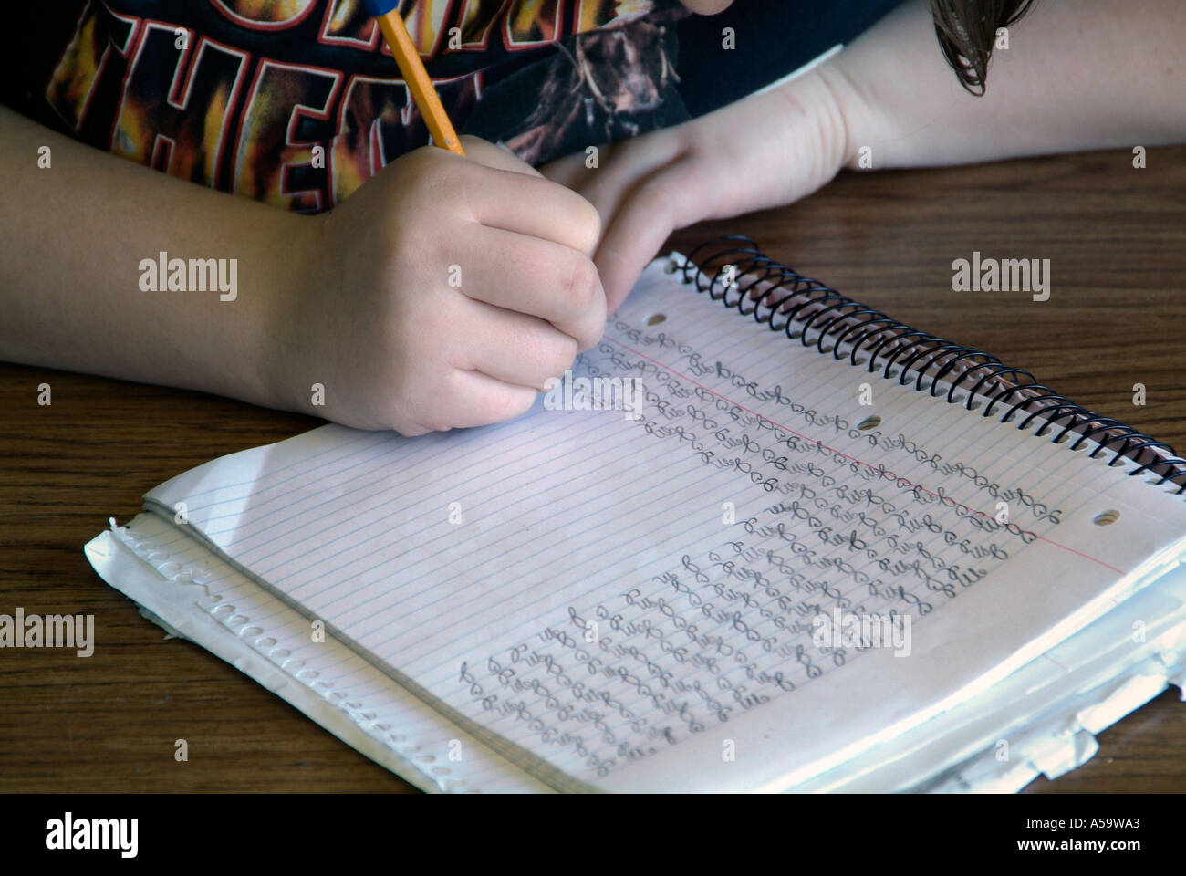 High school female practices handwriting in English class Stock Photo ...