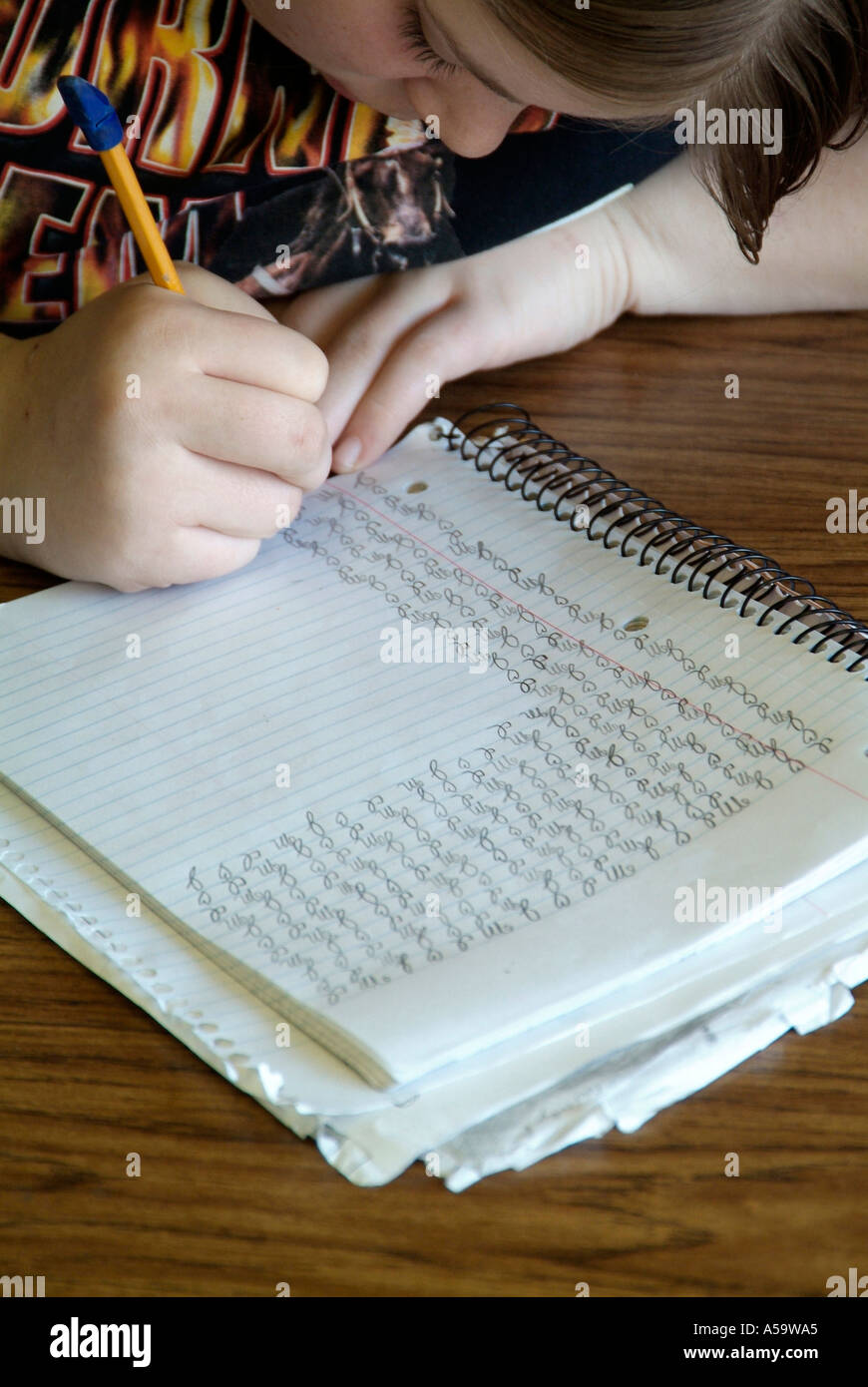 High school female practices handwriting in English class Stock Photo ...