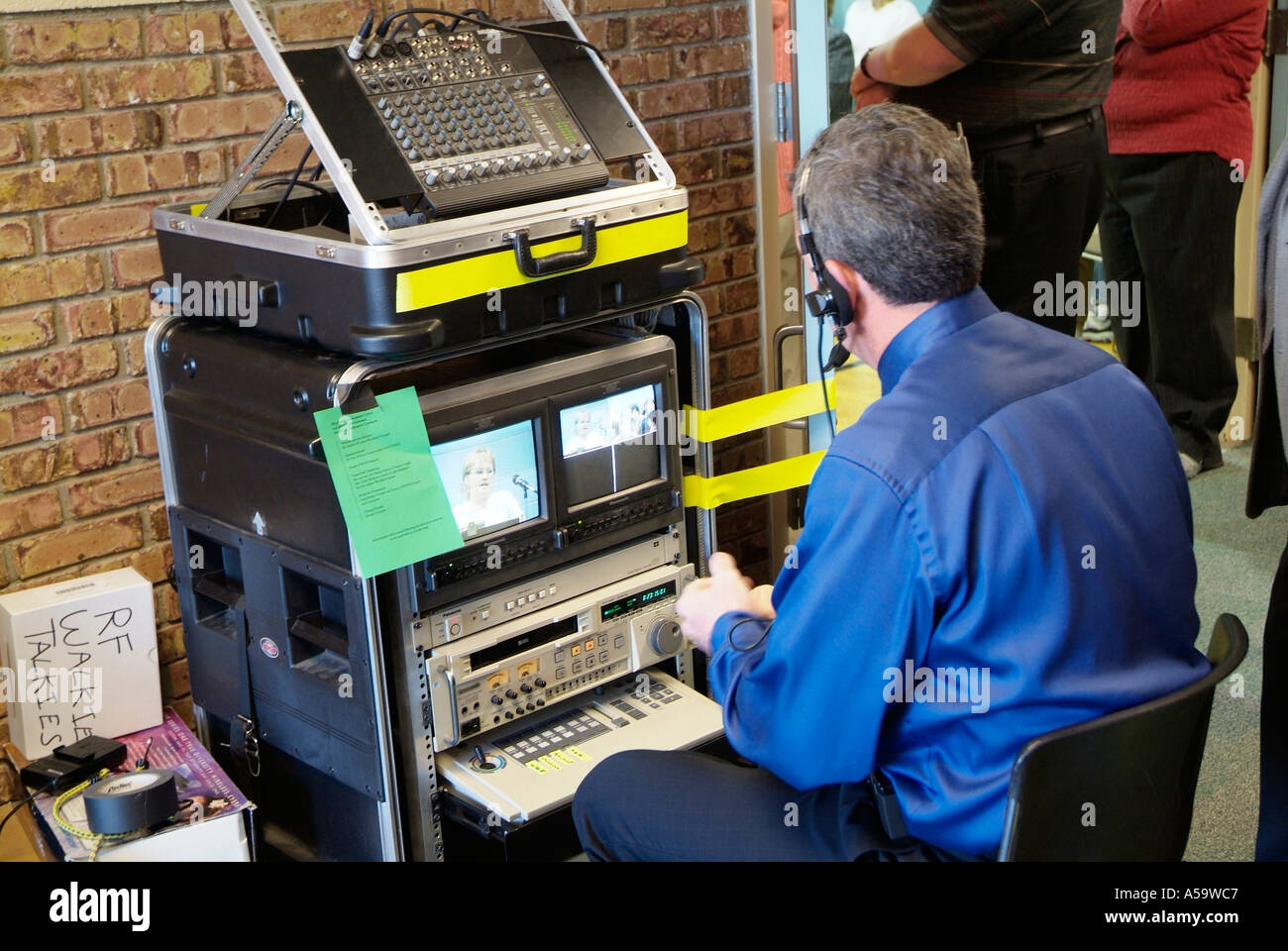Television production editor edits video for broadcast Stock Photo - Alamy