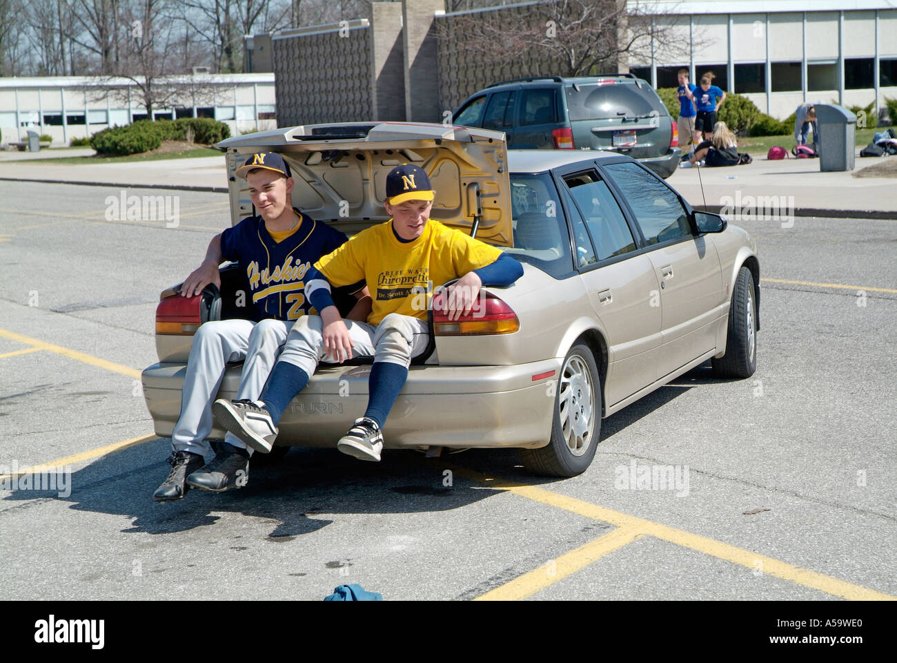 Students ride in the trunk of a car Stock Photo - Alamy