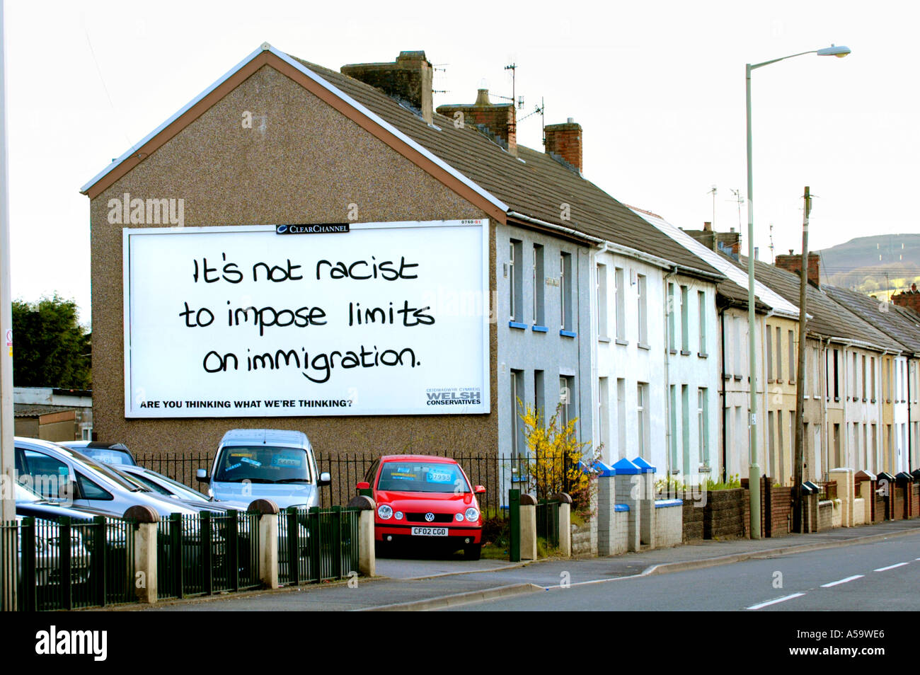Conservative immigration election poster on the end of a terraced house ...