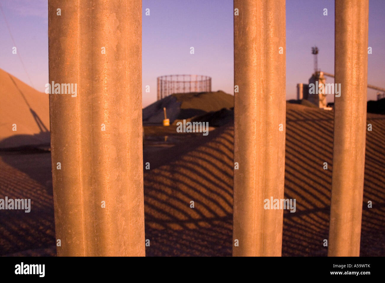 GAS ON MARS? Through-the-railings sunset view of an industrial site in ...