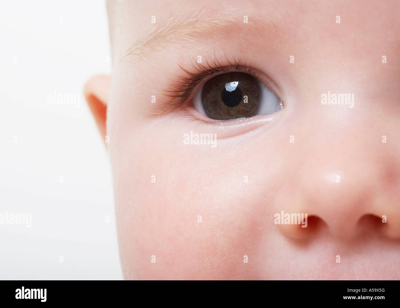 Close up baby girl looking sideways hi-res stock photography and images ...