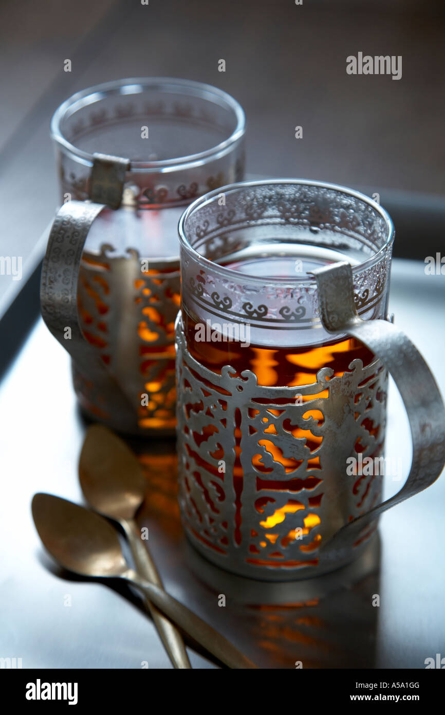 Two ornate glass cups of tea on a tray Stock Photo - Alamy