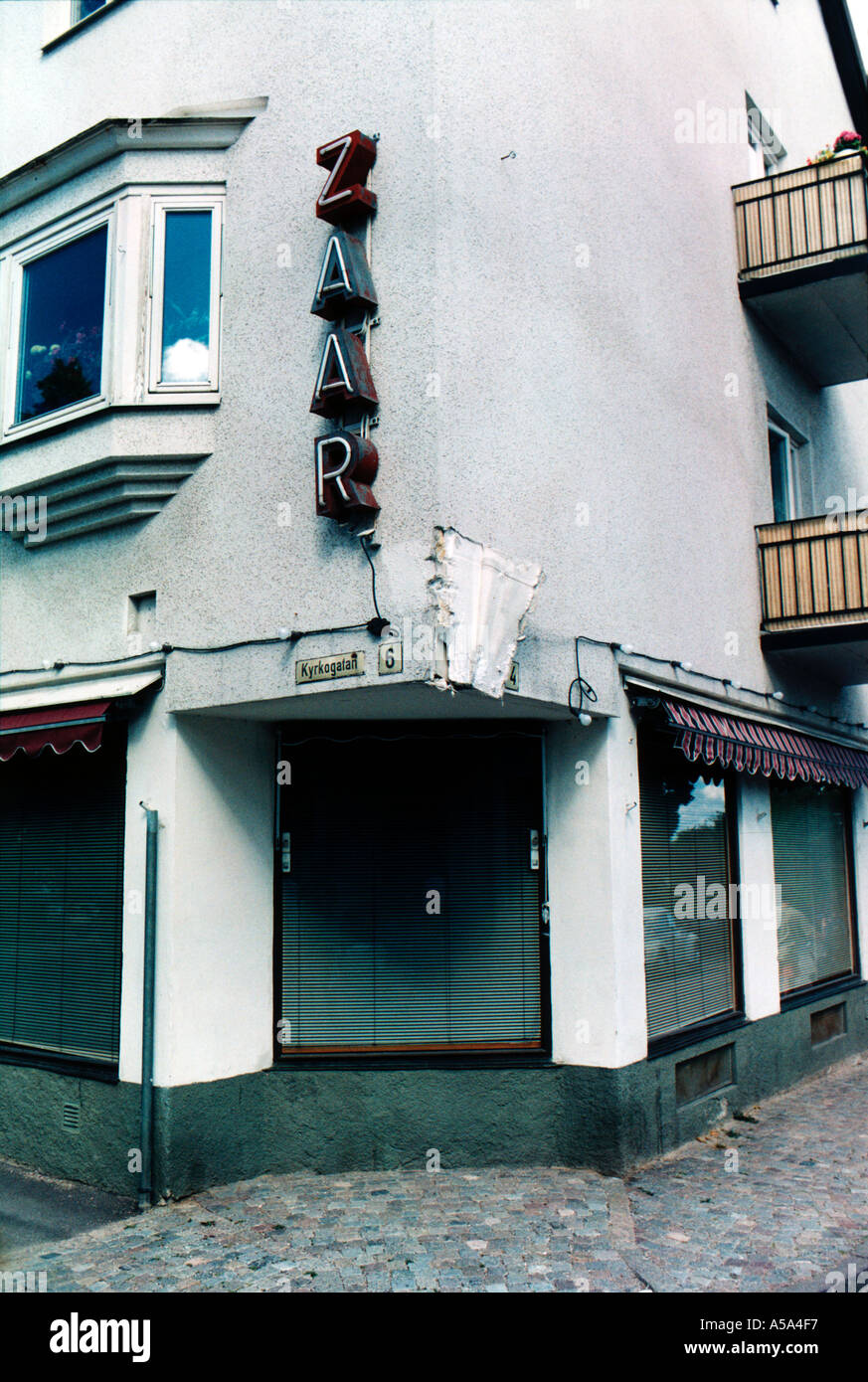 Shop corner with damaged house Stock Photo - Alamy