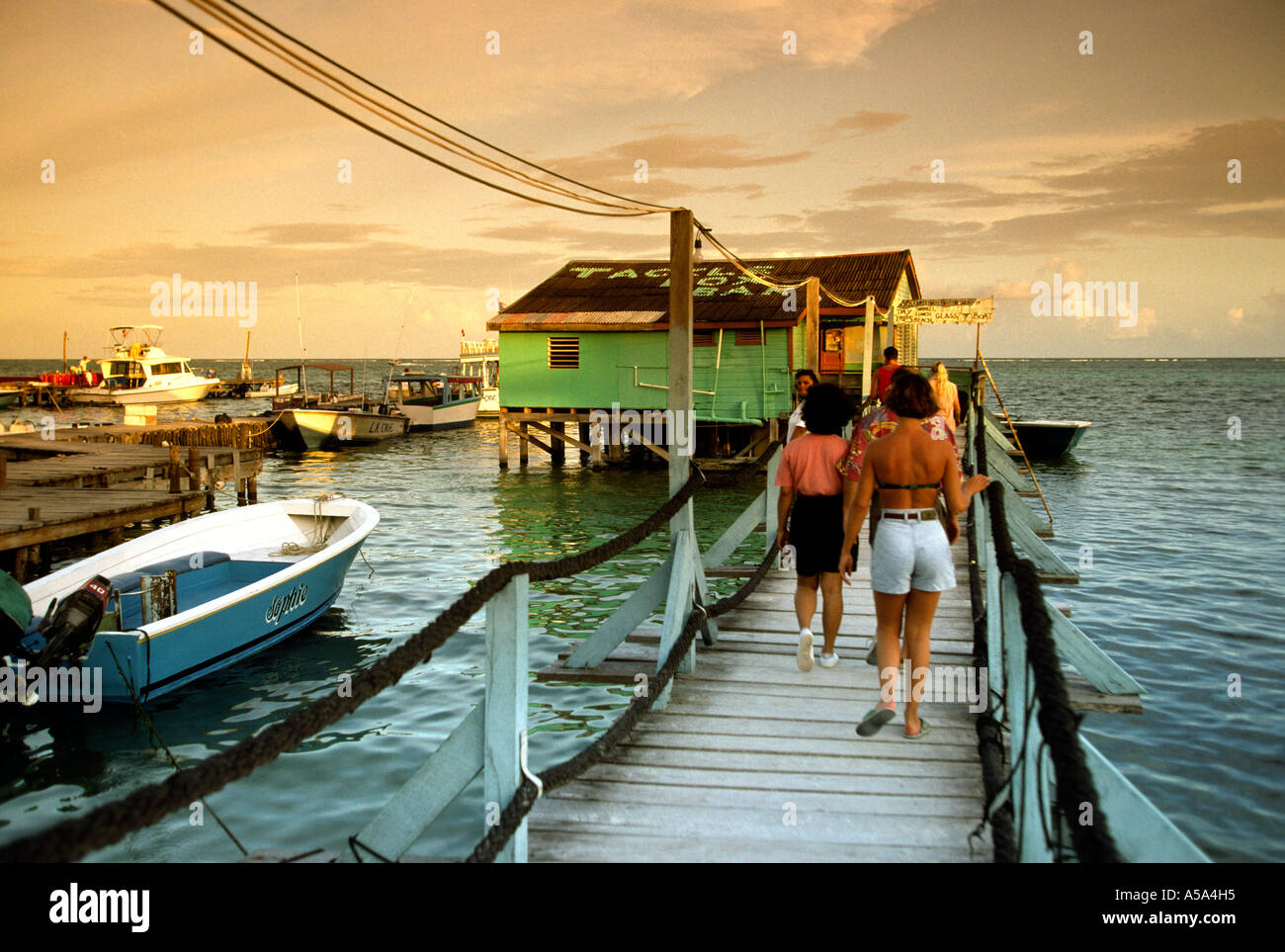 Belize Ambergris Cay Tackle Box Bar at sunset Stock Photo - Alamy