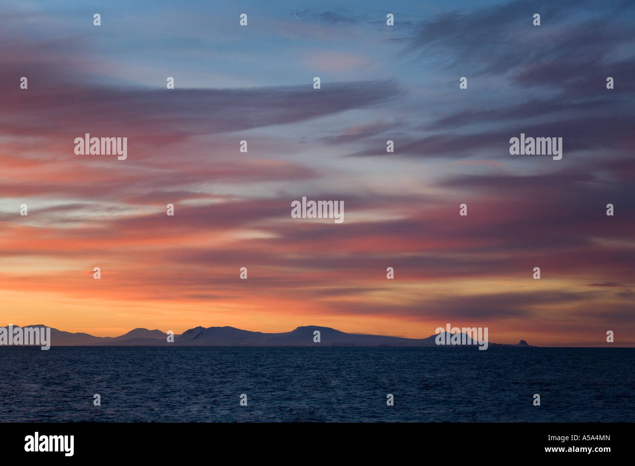 Midnight sun over the Drake Passage and the coast of Antarctica Stock ...