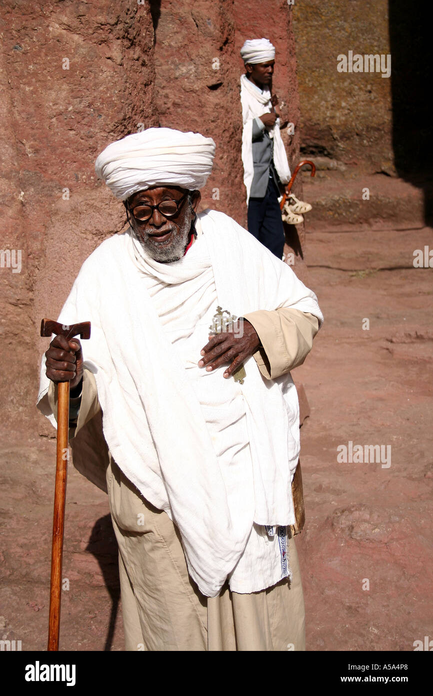 Lalibela, Ethiopia, Bishop holding a cross and walking with a cane ...