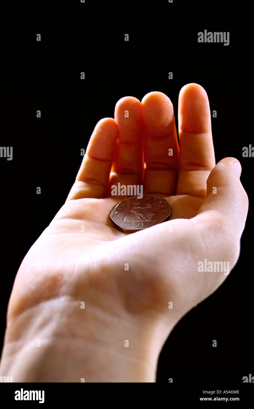 Money shot 2p in hand Stock Photo - Alamy