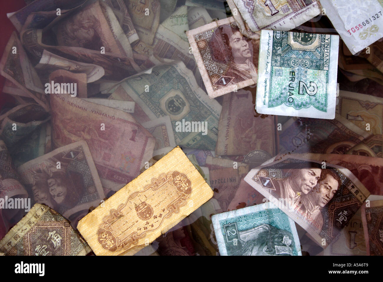 Macau, A-Ma Temple, Chinese and macanese money mingle in a pot of water ...