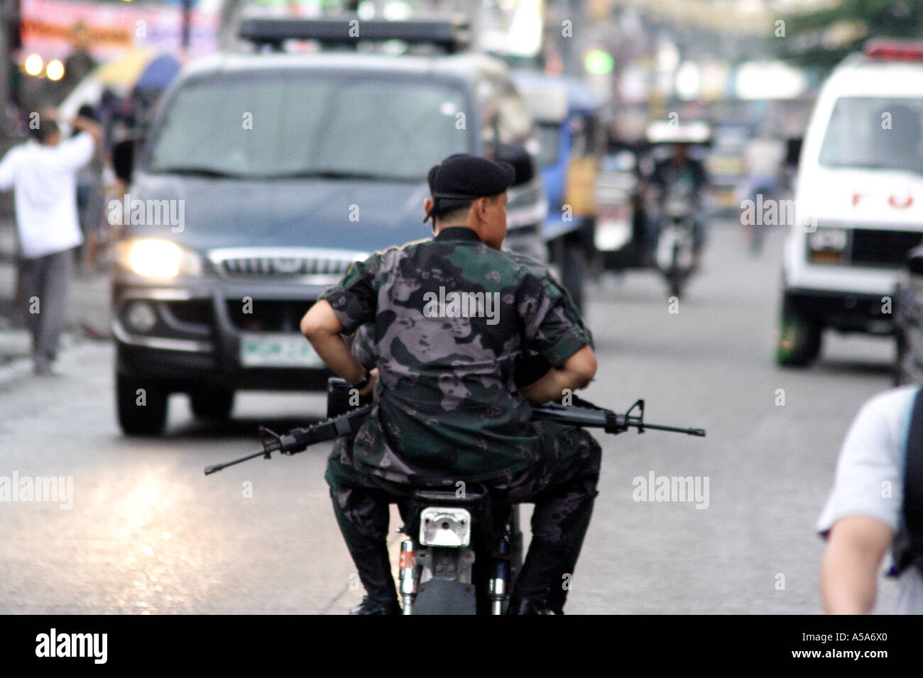 Two armed philippine army soldiers riding a motorcycle, Angeles City ...