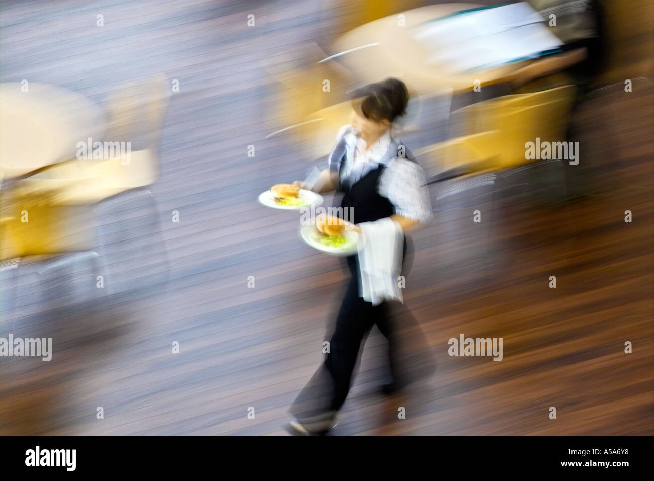 Fast food waitress serving food Stock Photo - Alamy