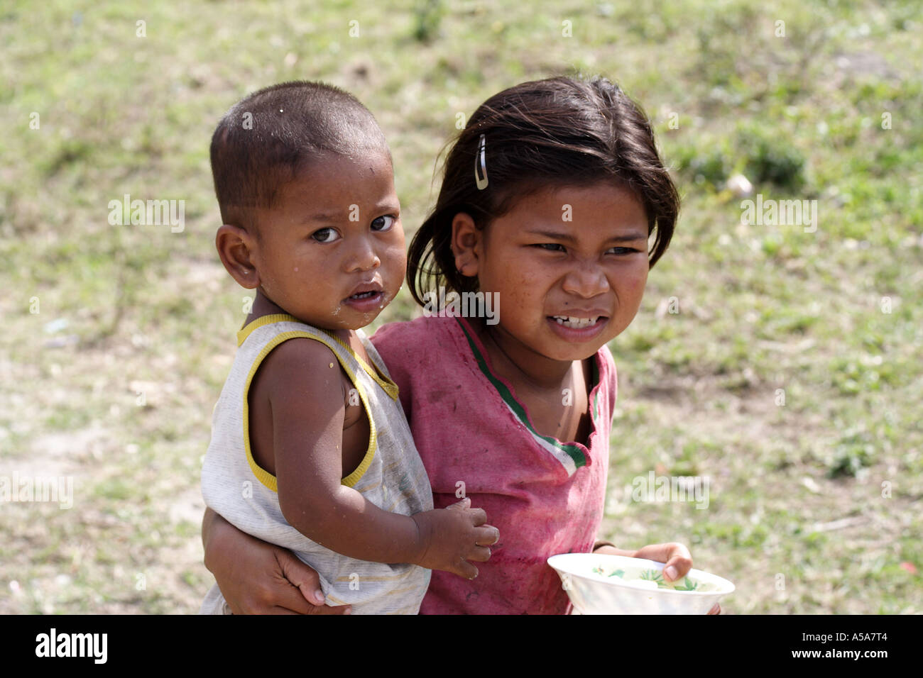 Young Aeta girl and her sister near Mount Pinatubo, Crater lake ...