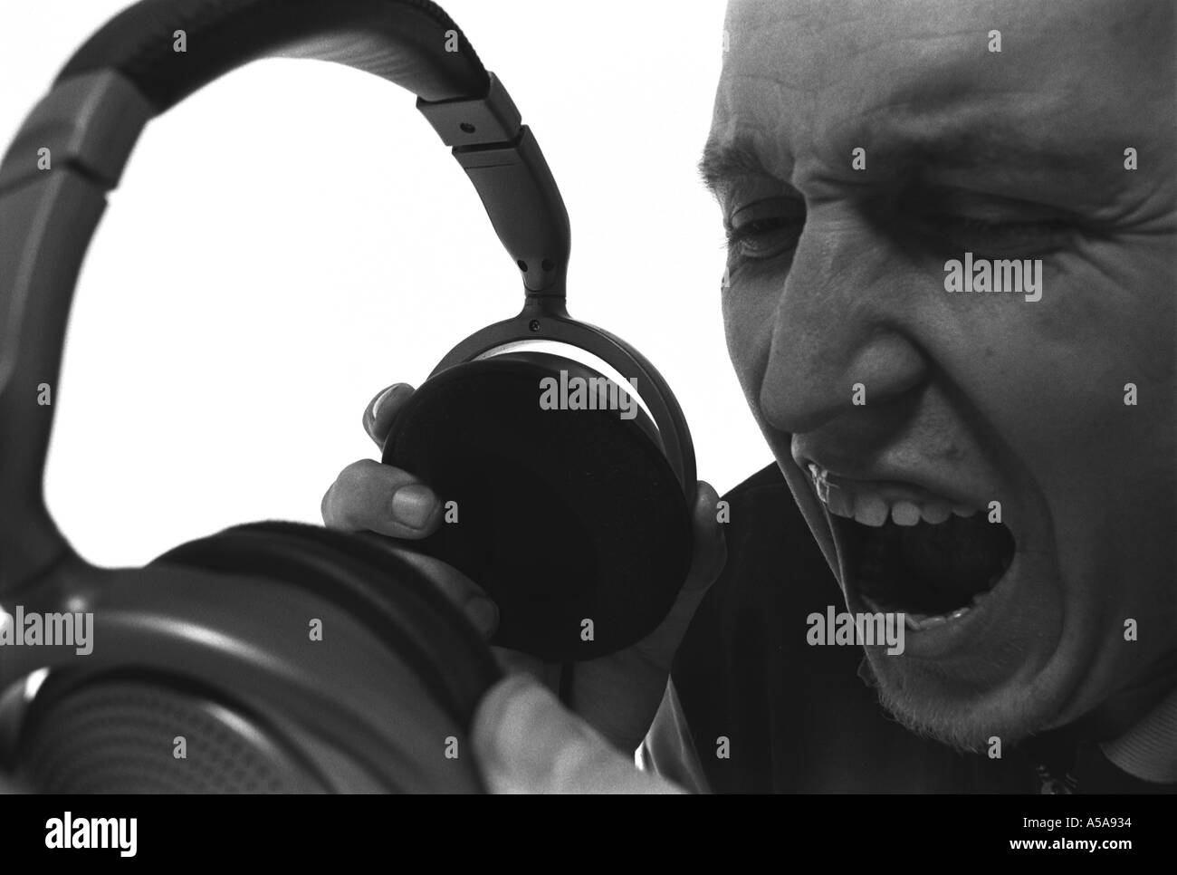 Headphones talking Black and White Stock Photos & Images - Alamy