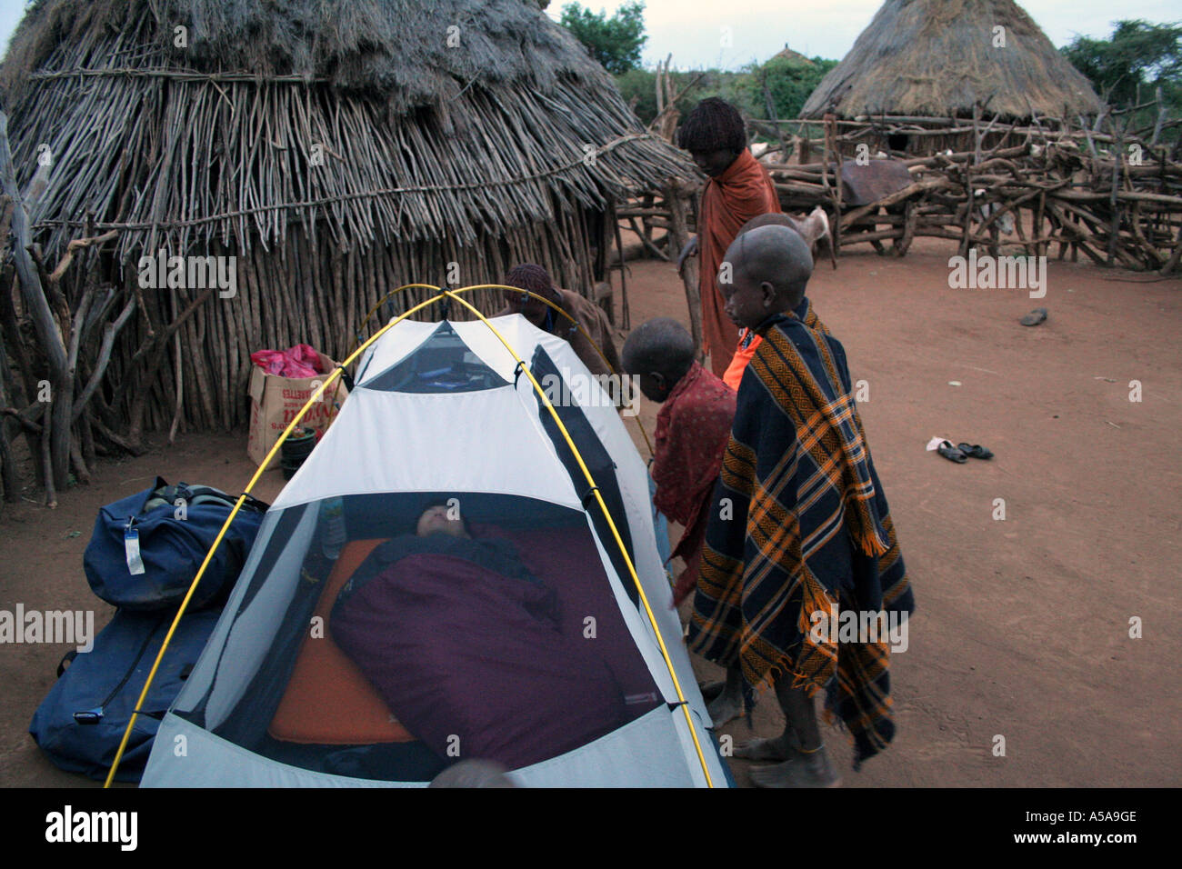 Hamer tribe, children stare at sleeping foreign vistior, Lower Omo ...