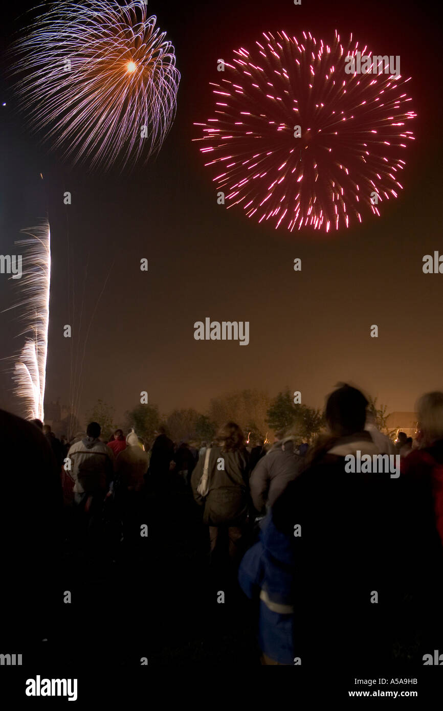 People watching fireworks being let off at an organised bonfire and ...