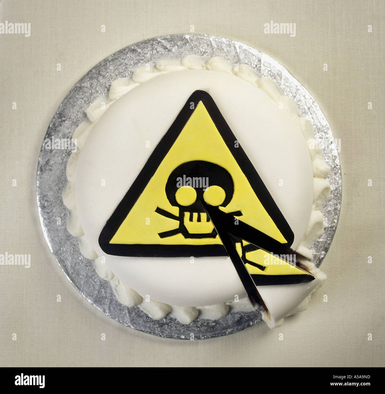 a cake with a poison sign made from icing Stock Photo - Alamy