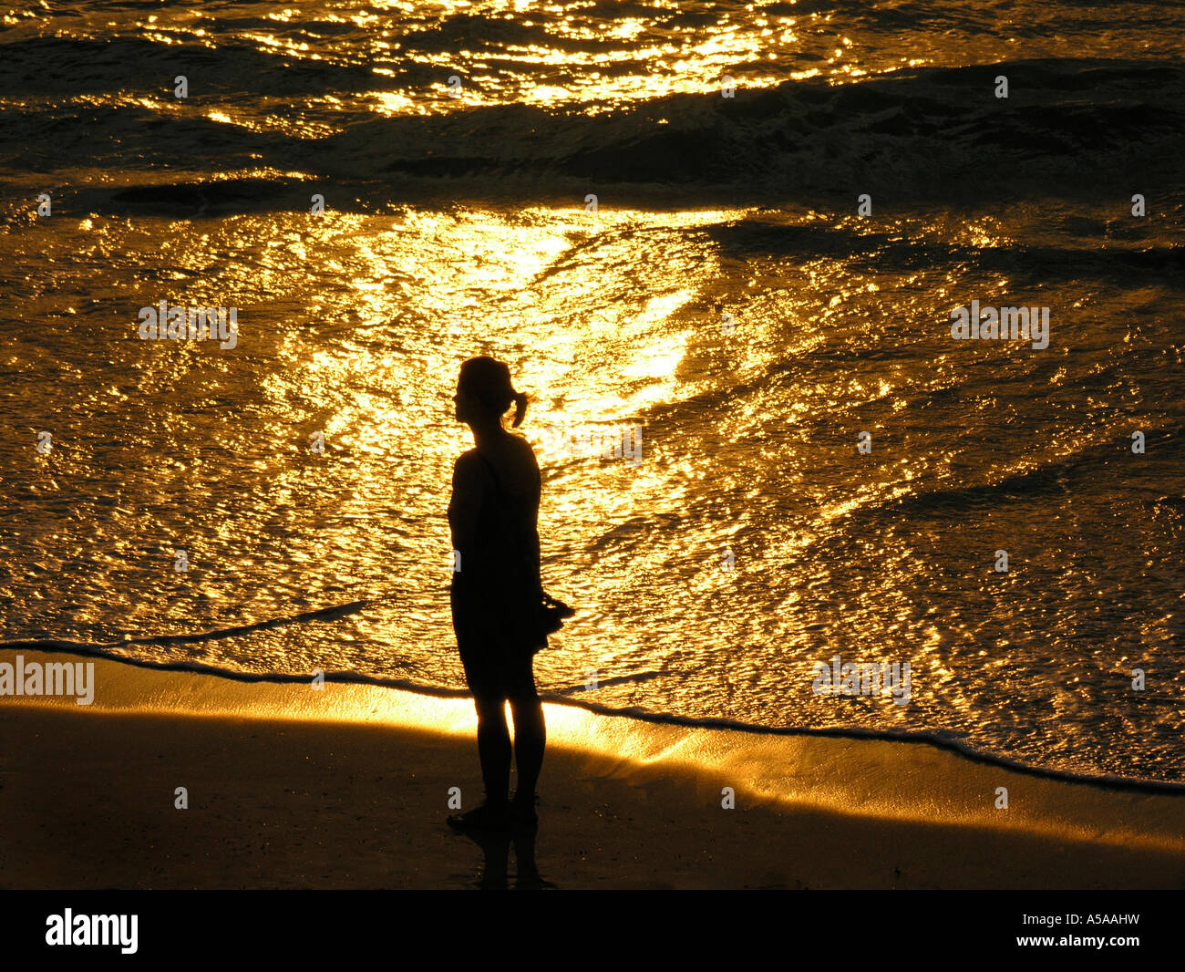Woman glistening beach hi-res stock photography and images - Alamy