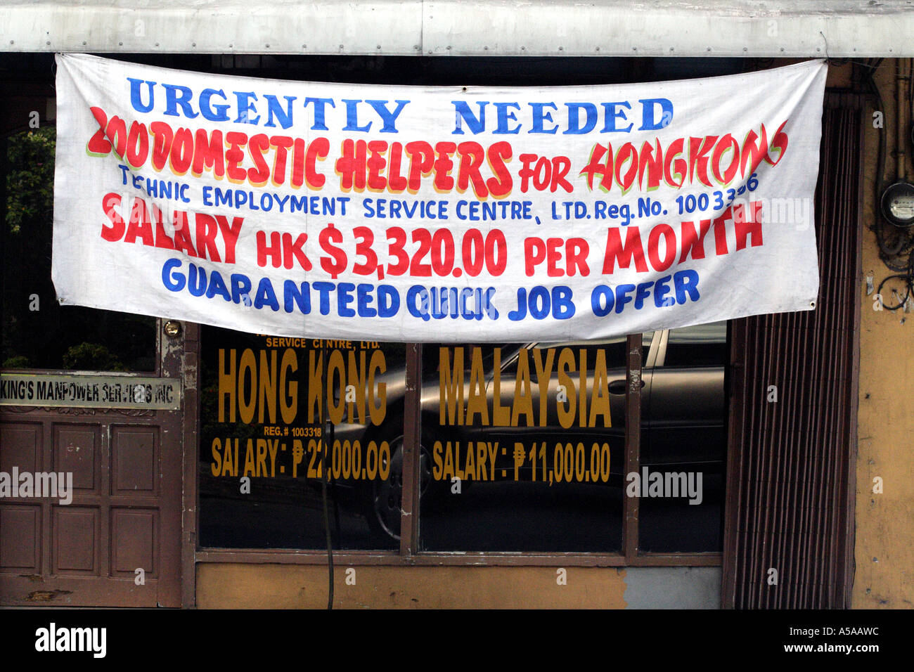 Manila, Philippine Islands, a sign at an employment agency advertises ...