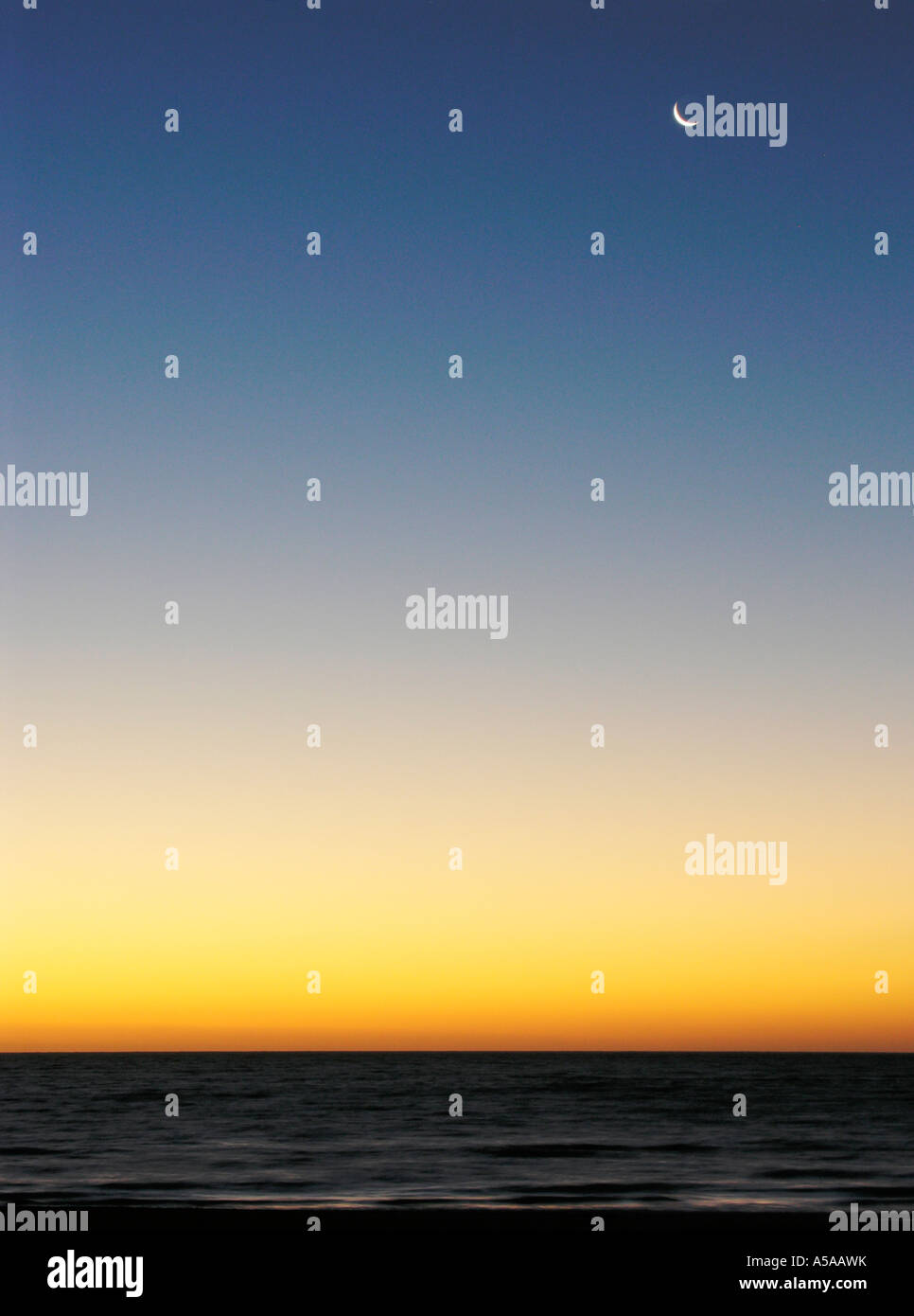 Crescent moon over sea Stock Photo - Alamy