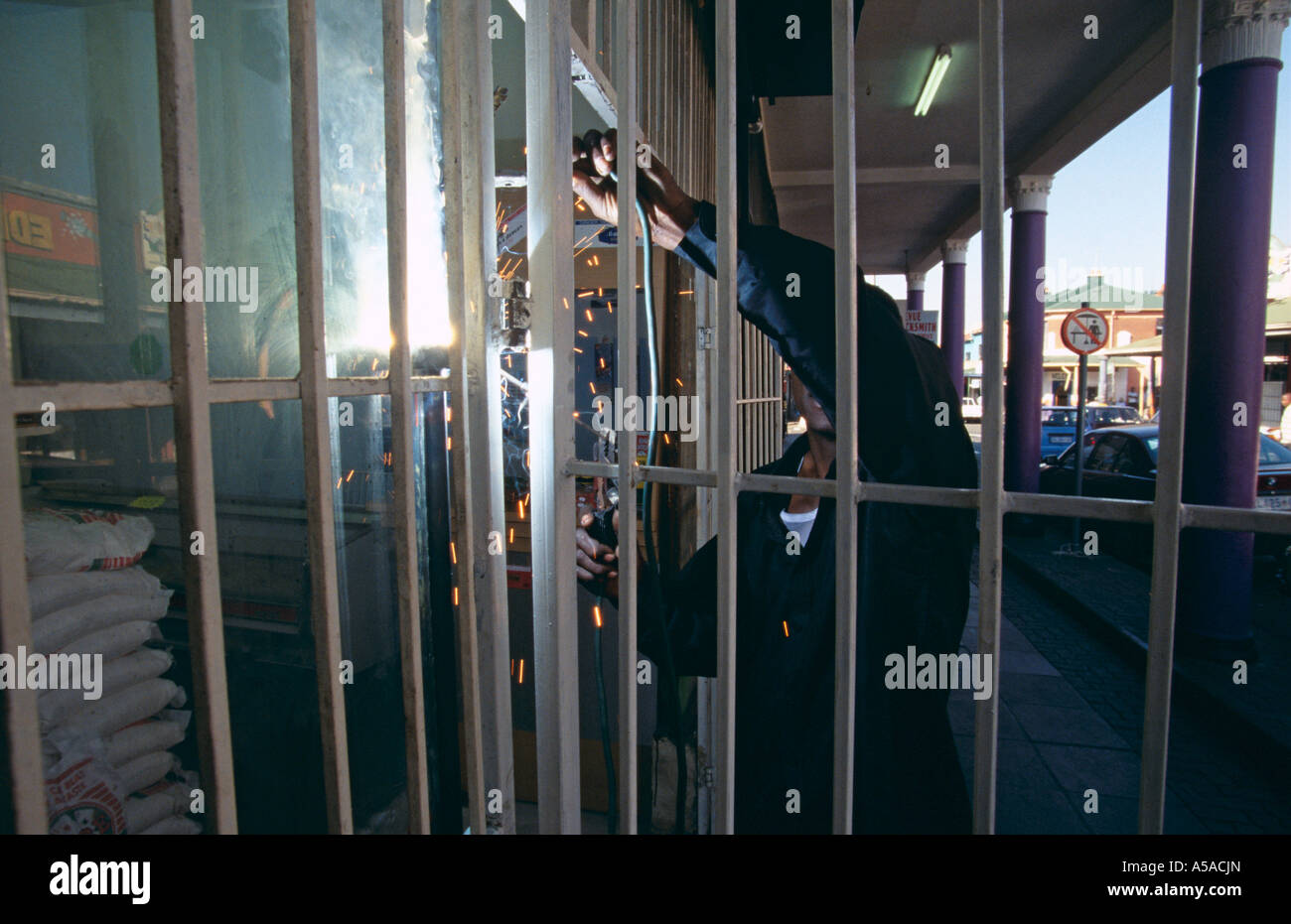 Worker welding a gate Stock Photo - Alamy