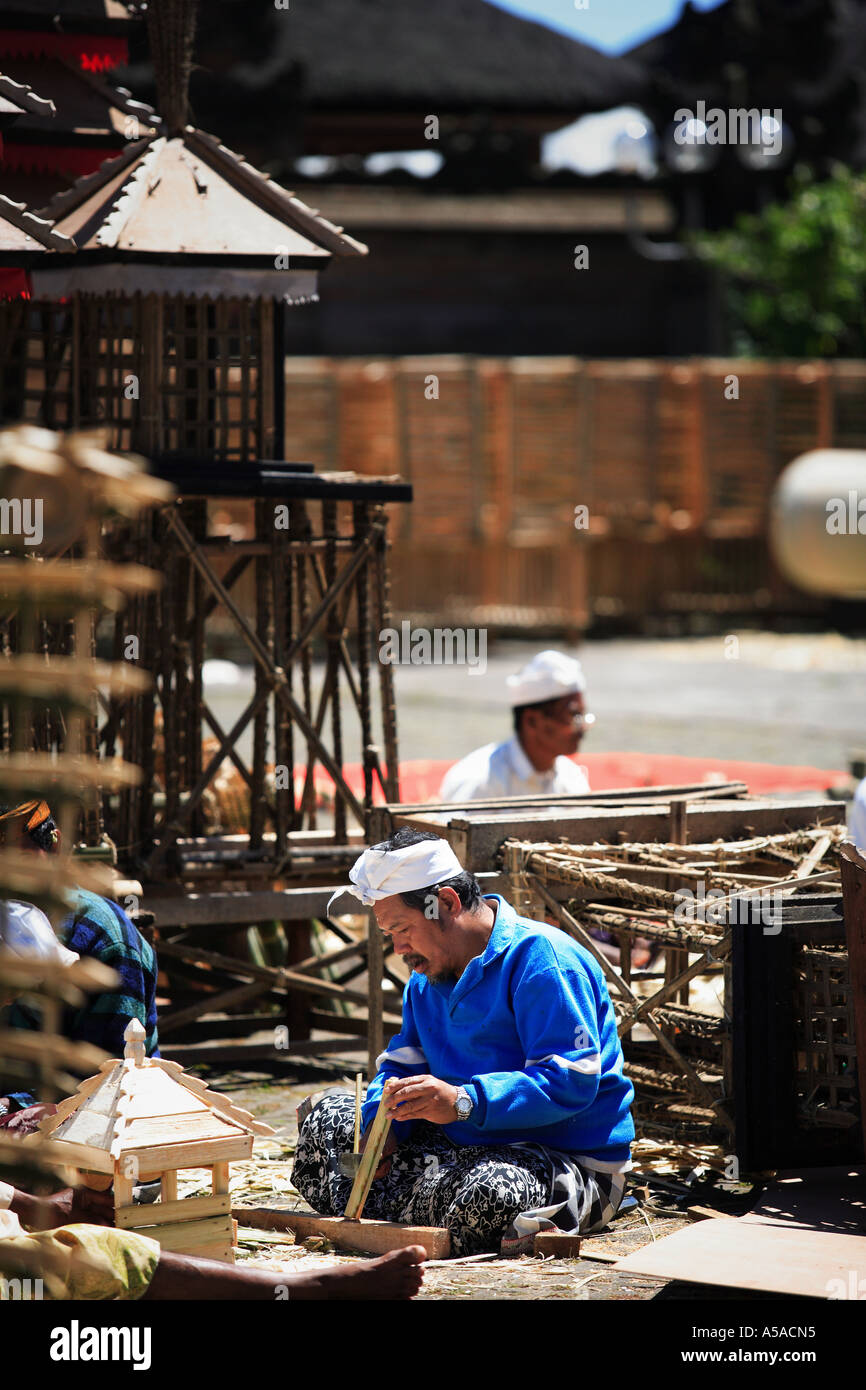 Man working in a temple Stock Photo - Alamy