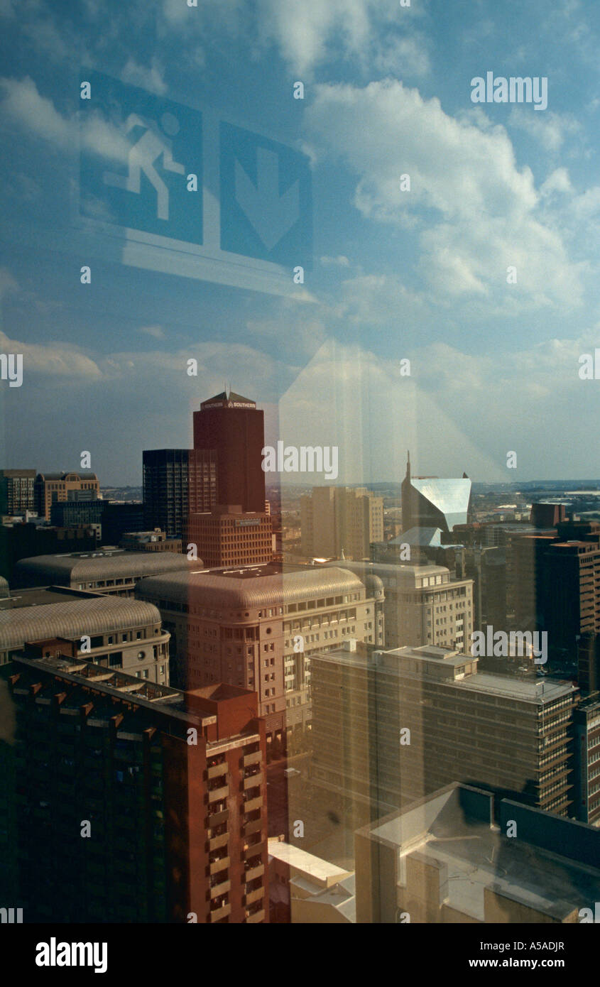 The skyline of Johannesburg seen through a glass window Stock Photo - Alamy