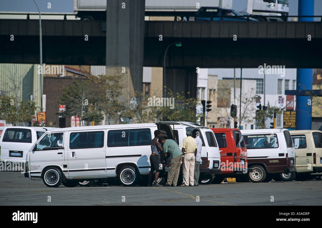 A taxi parking lot under a spanning bridge in Johannesburg South Africa ...
