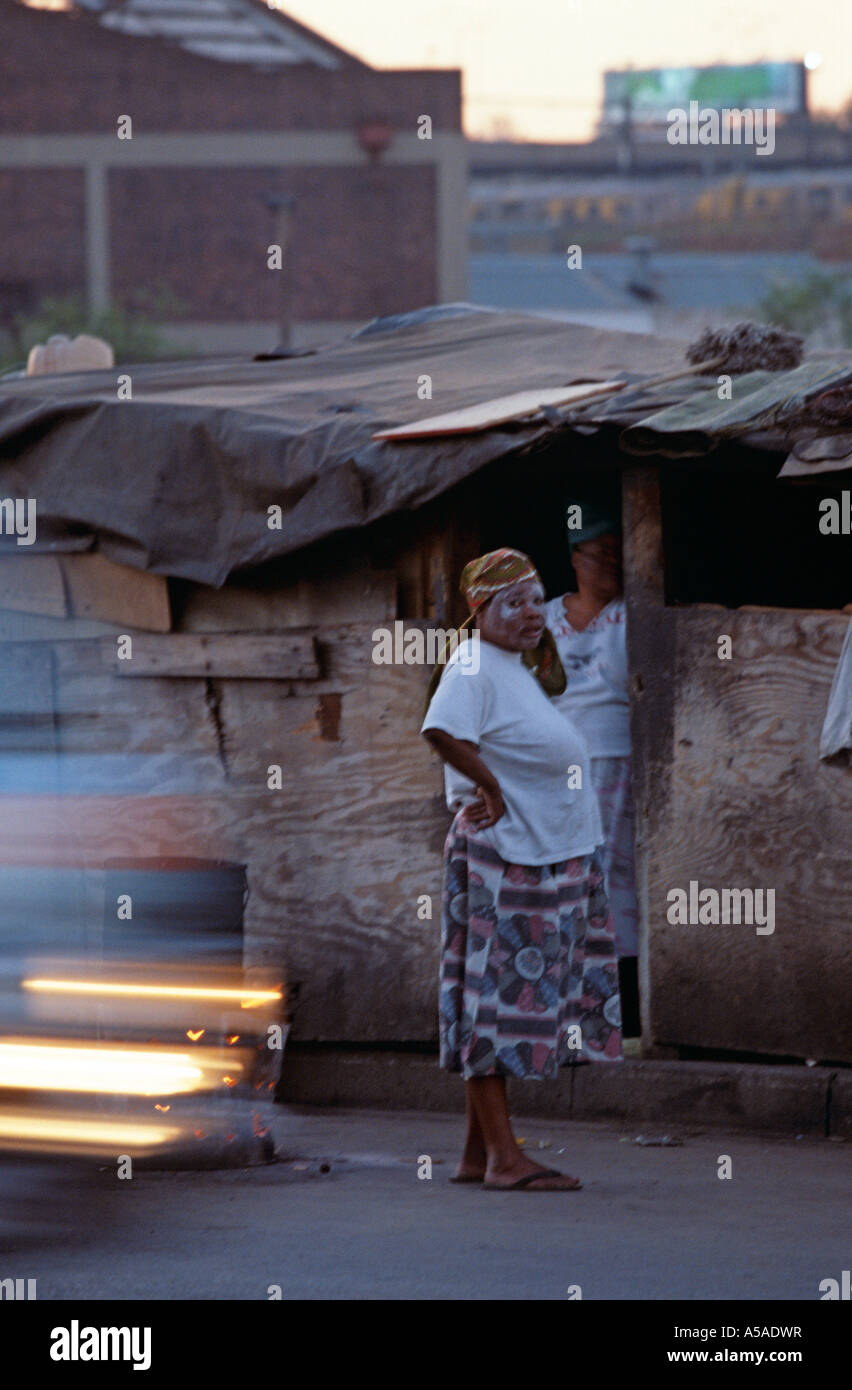 Women standing in front of their shack at a slum in Johannesburg Stock ...