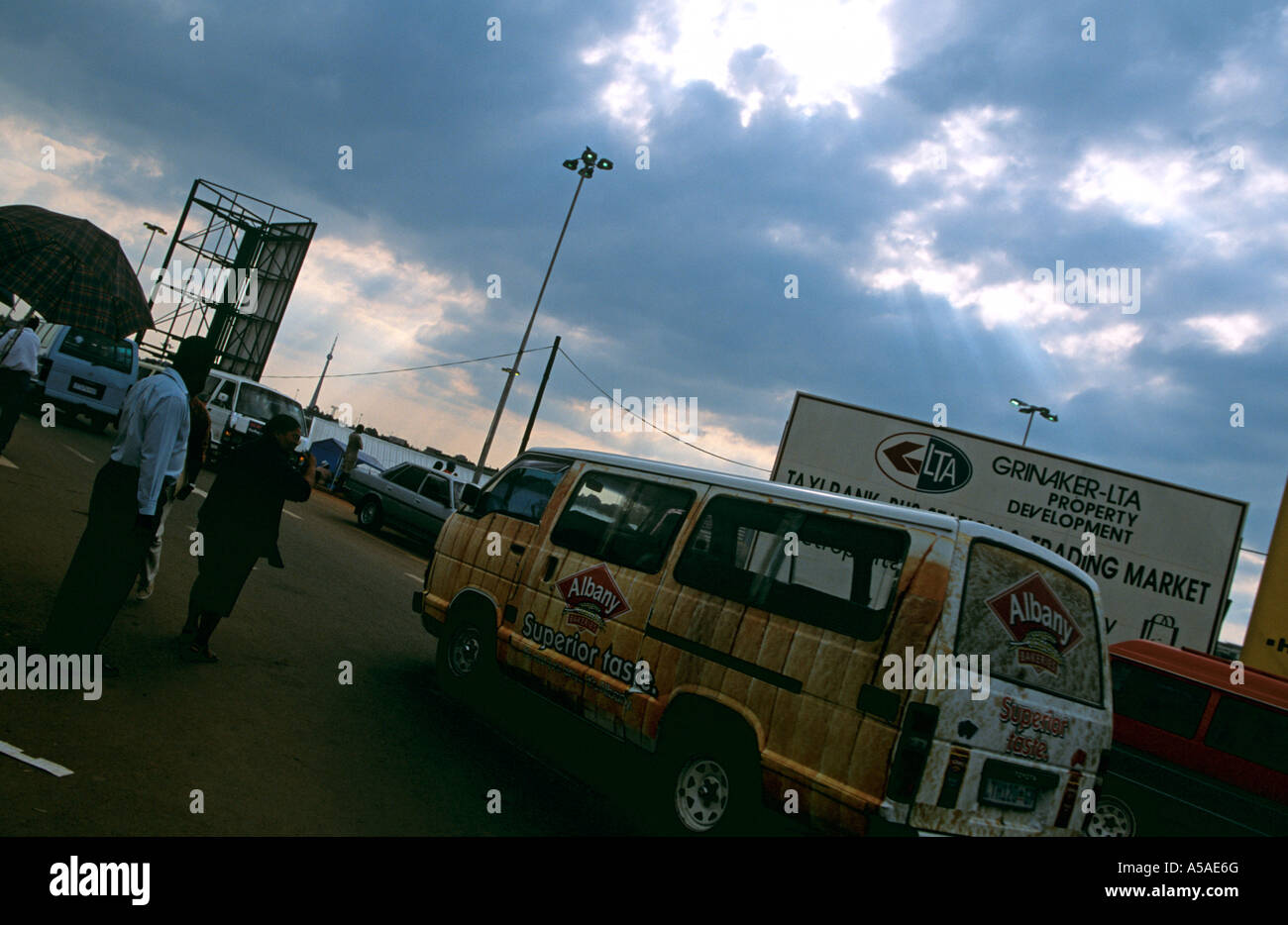 Vans and cars at a parking lot in Johannesburg South Africa Stock Photo ...