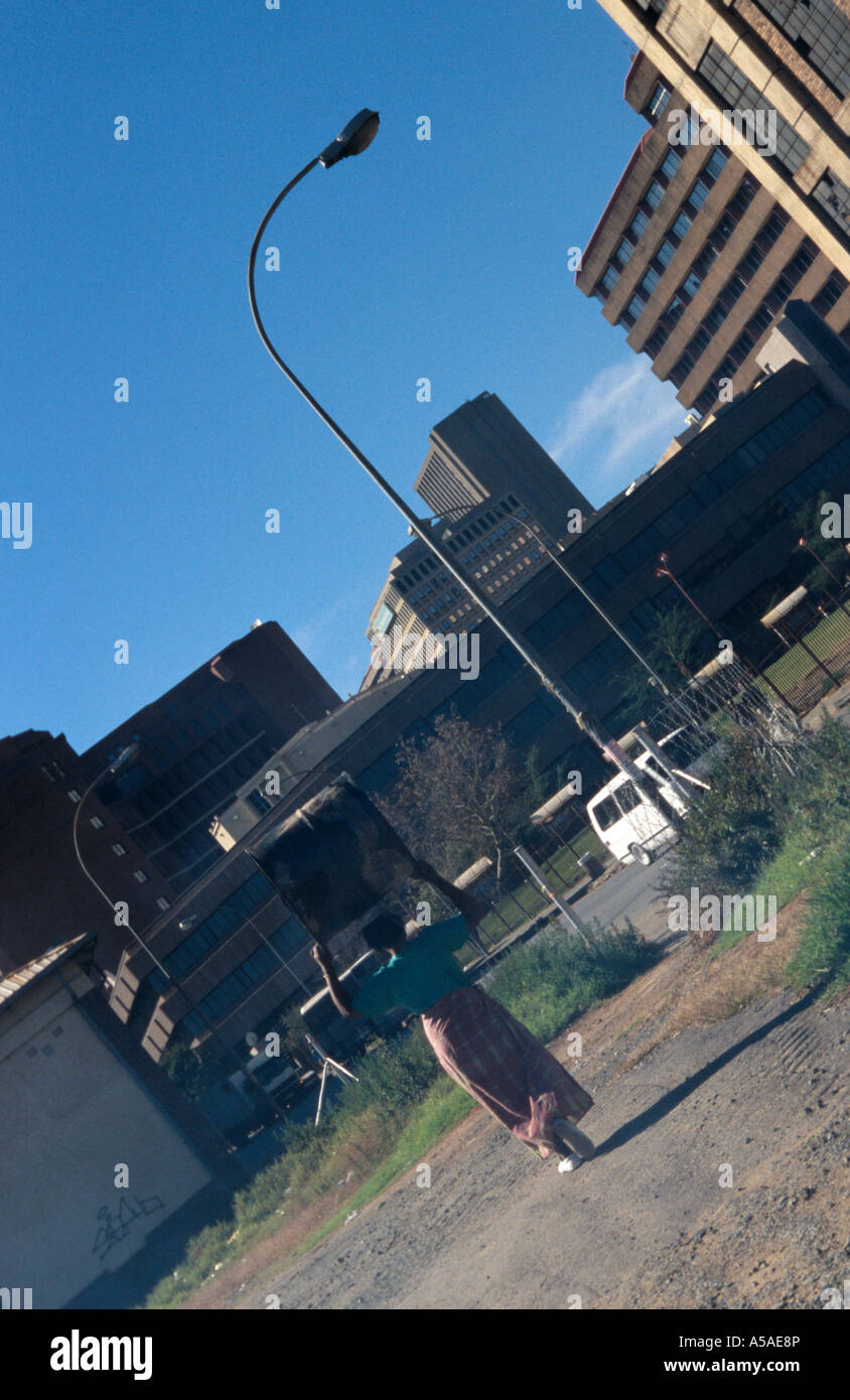 A South African woman carrying a barrel on her head Stock Photo - Alamy