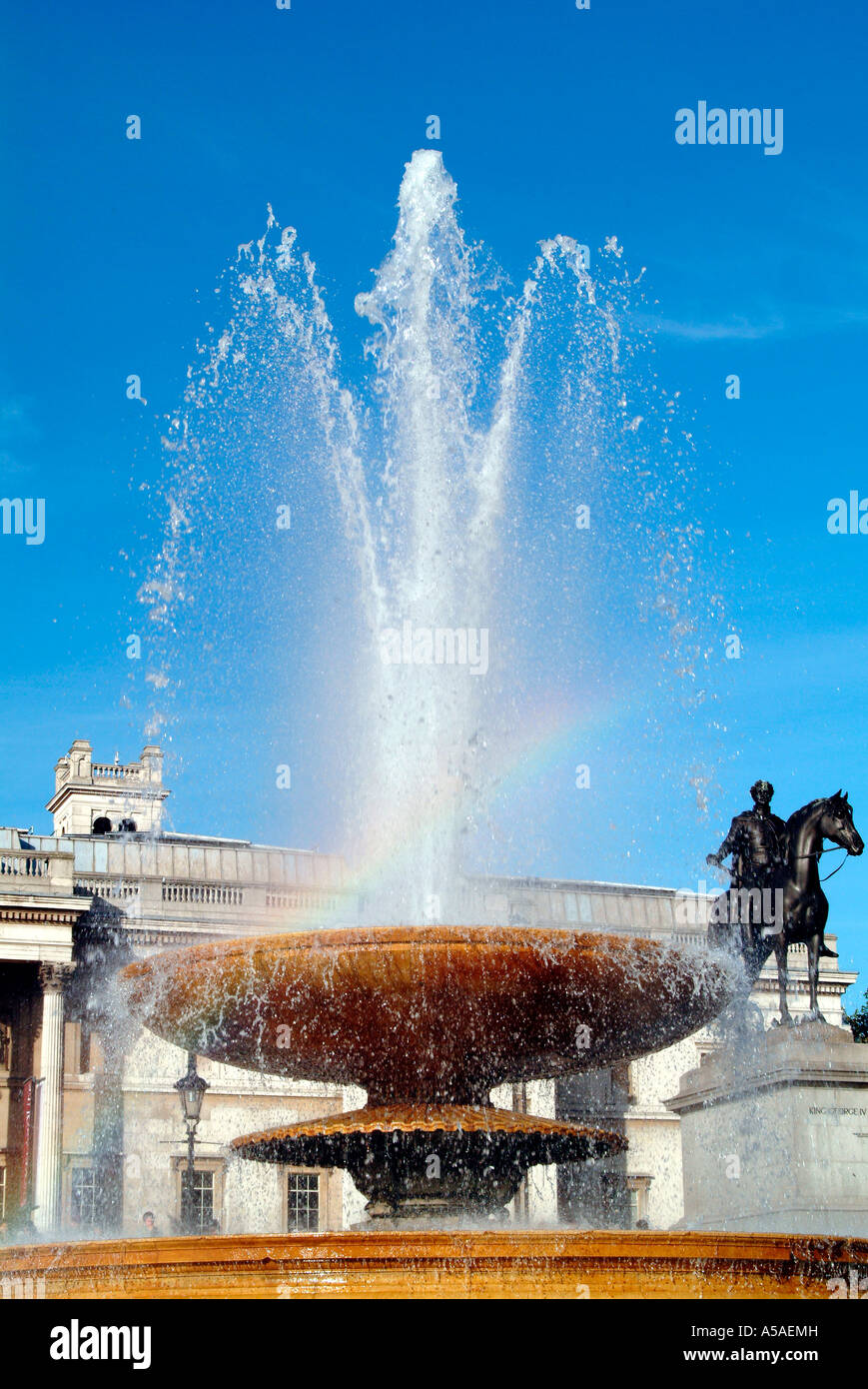 Trafalgar Square fountain with rainbow London Stock Photo - Alamy