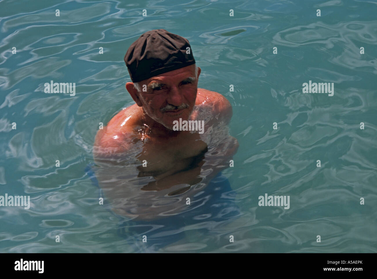 A man swimming in a pool in Kosovo Serbia and Montenegro Stock Photo ...