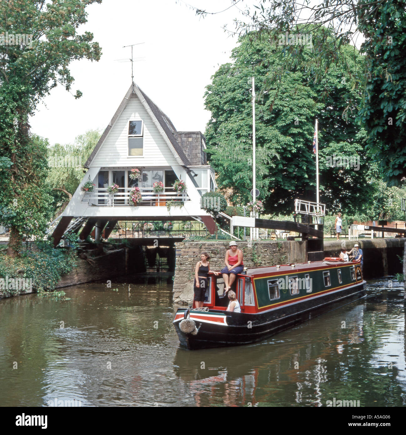 A holiday narrowboat leaving the lock at Evesham on the River Avon Also ...