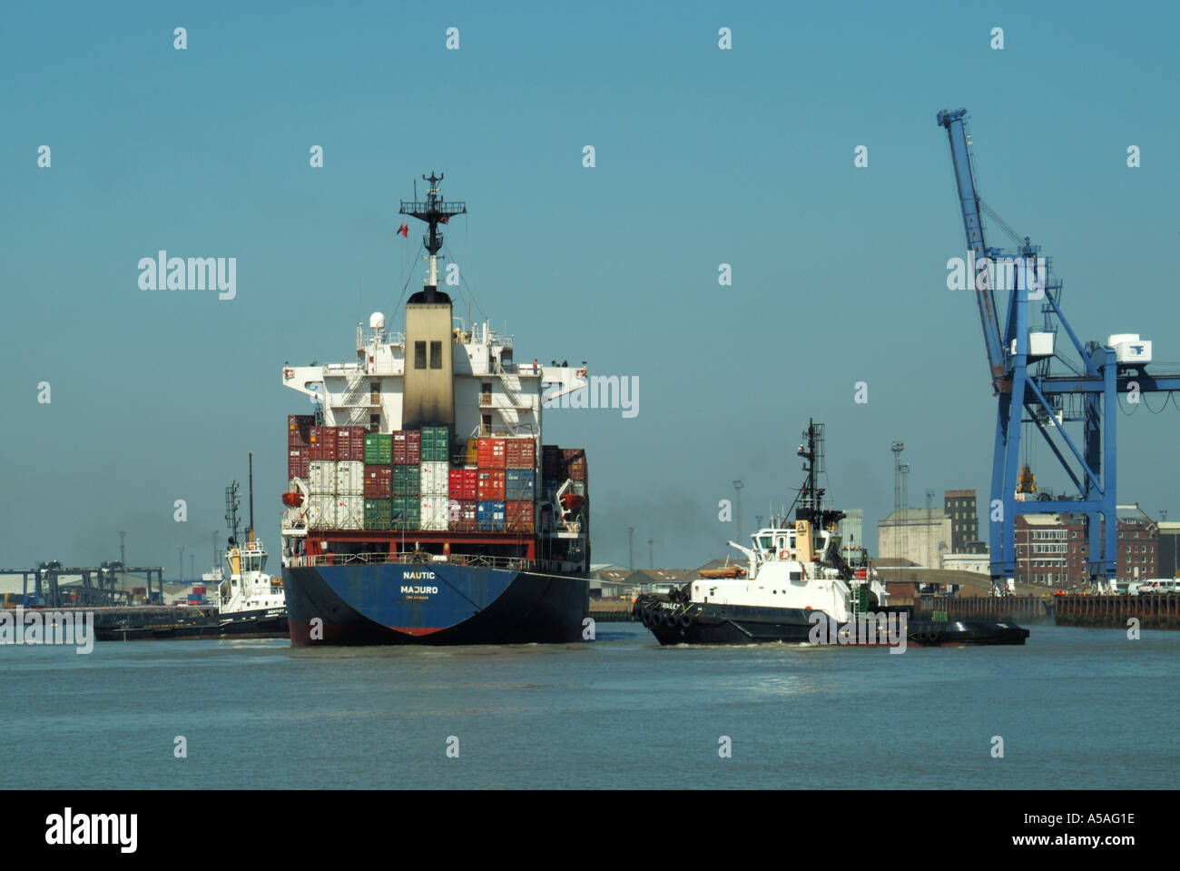 Arriving cargo container freighter ship stacked full with load of ...