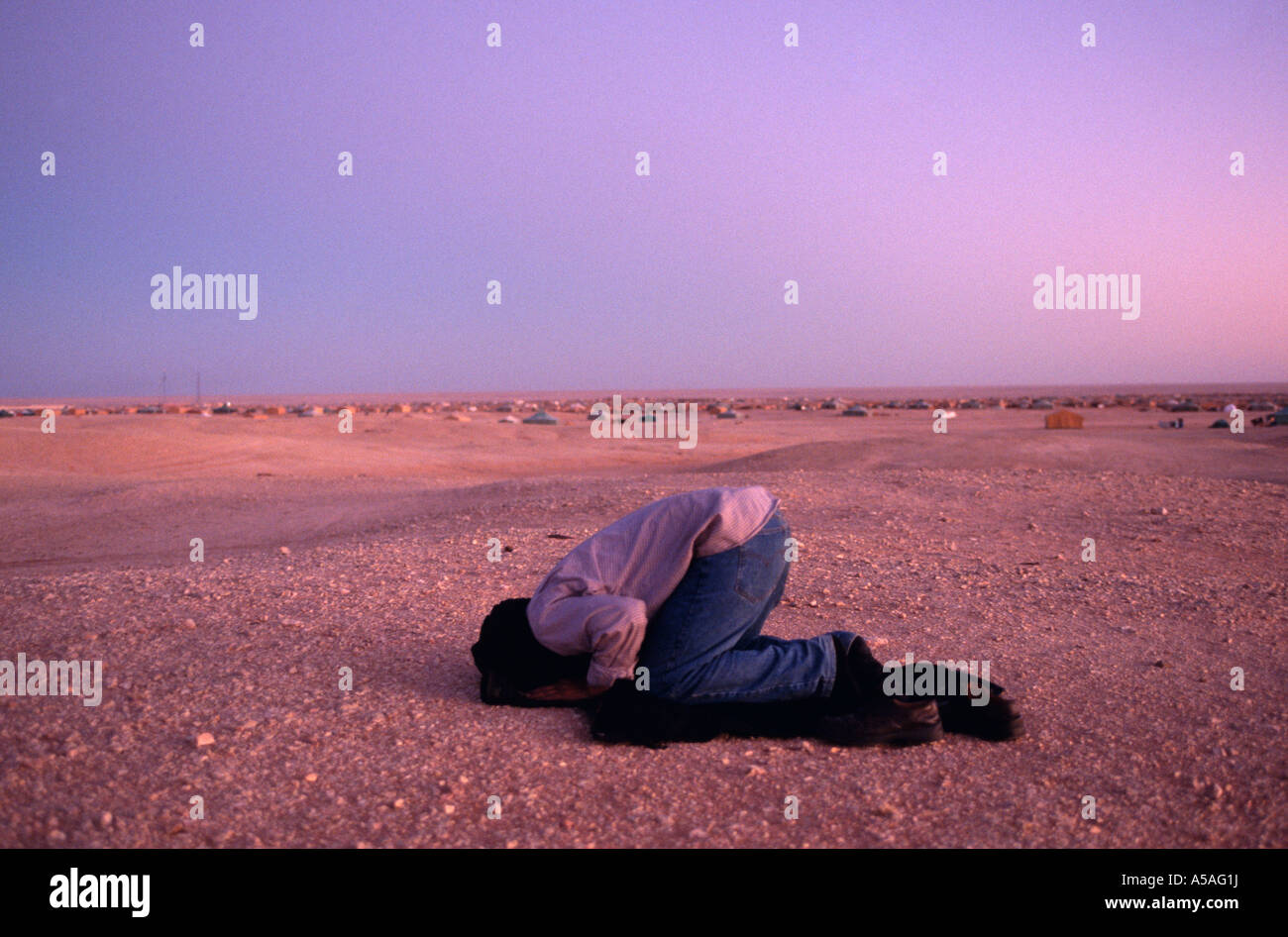 Muslim man praying near refugee camp, Tindouf, Western Algeria Stock ...