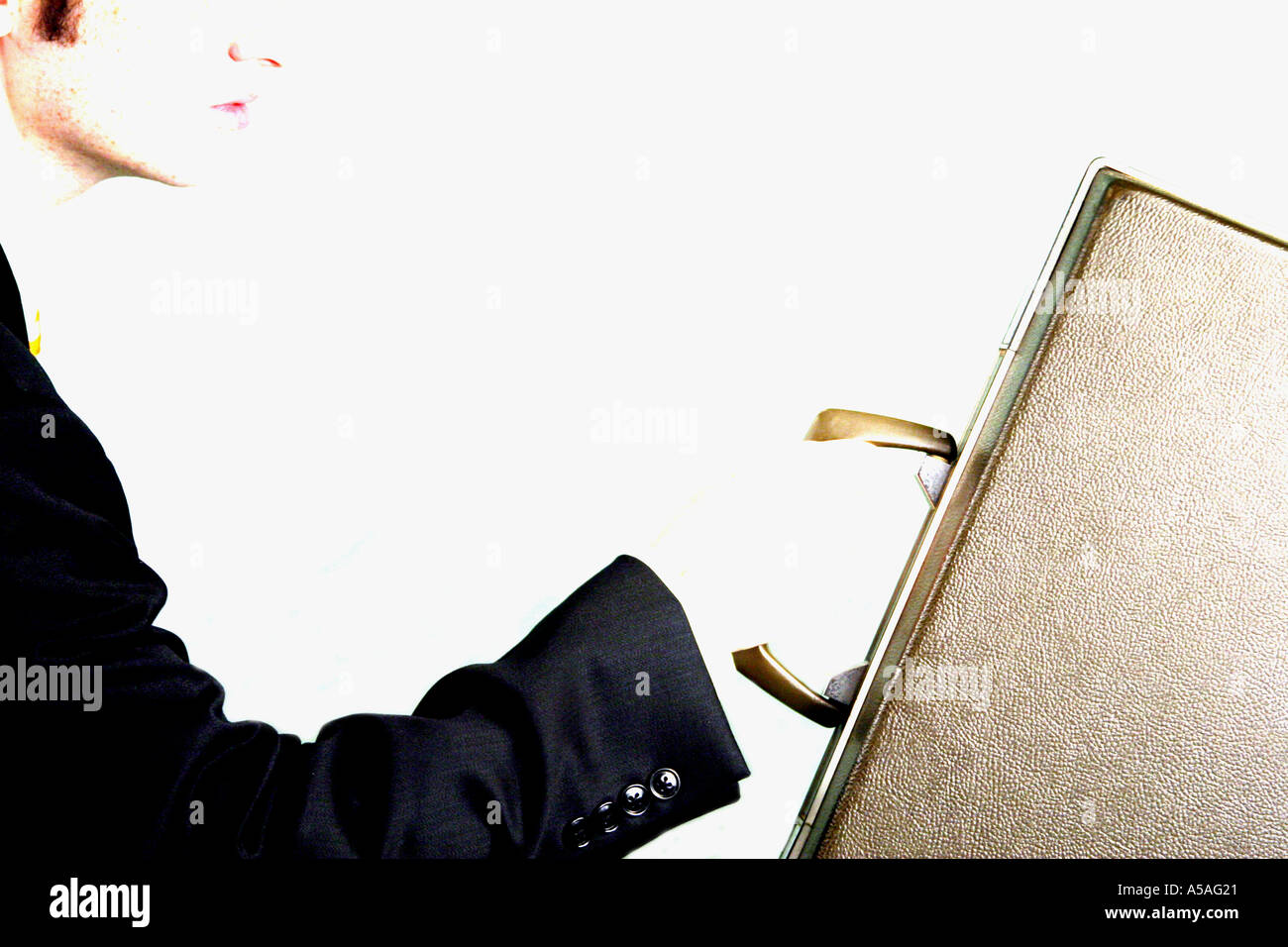 Businessman swinging his briefcase #2 Stock Photo - Alamy