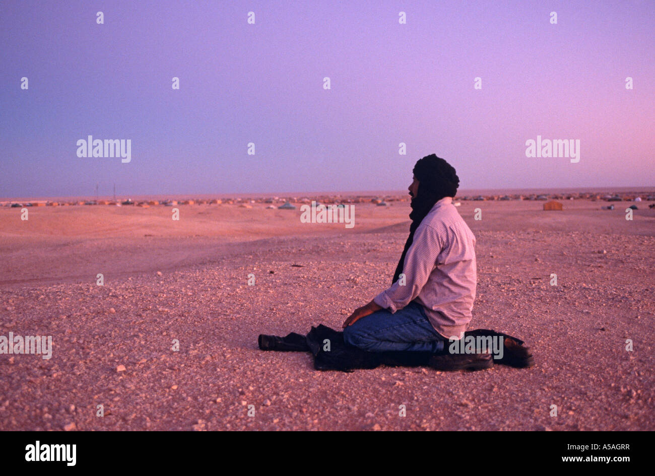 Muslim man performing daily ritual prayers, Saharawi refugee camp ...