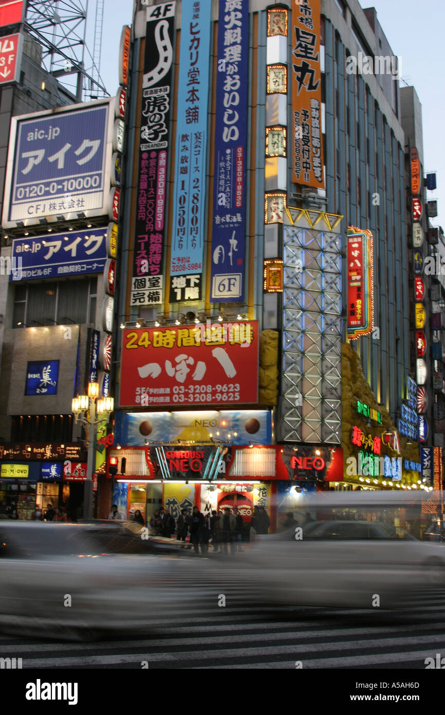 Traffic at busy intersection on Shinjuku dori Tokyo Japan Stock Photo ...