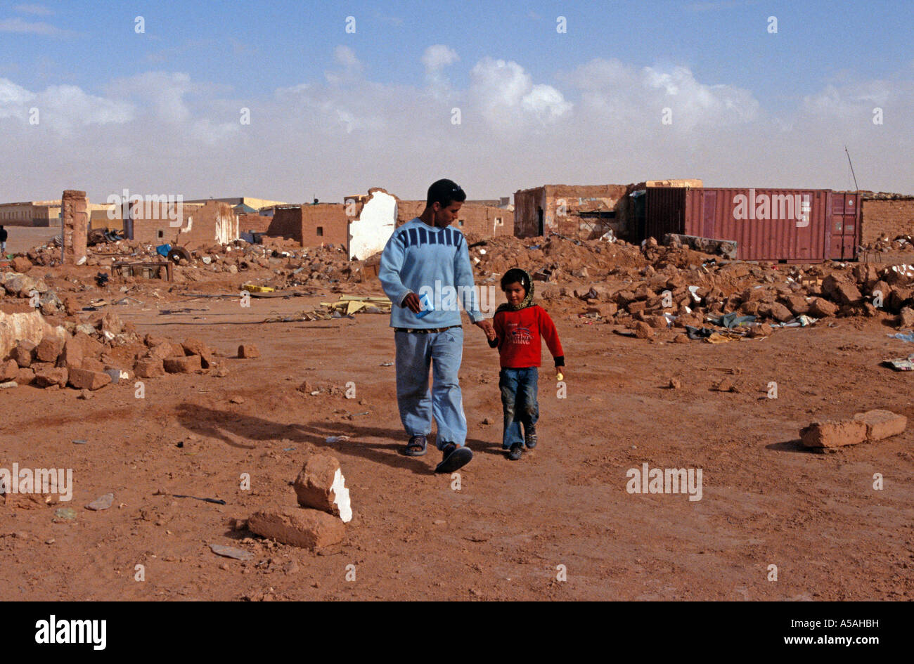 A Sahrawi man walking with a girl in Tindouf Western Algeria Stock ...