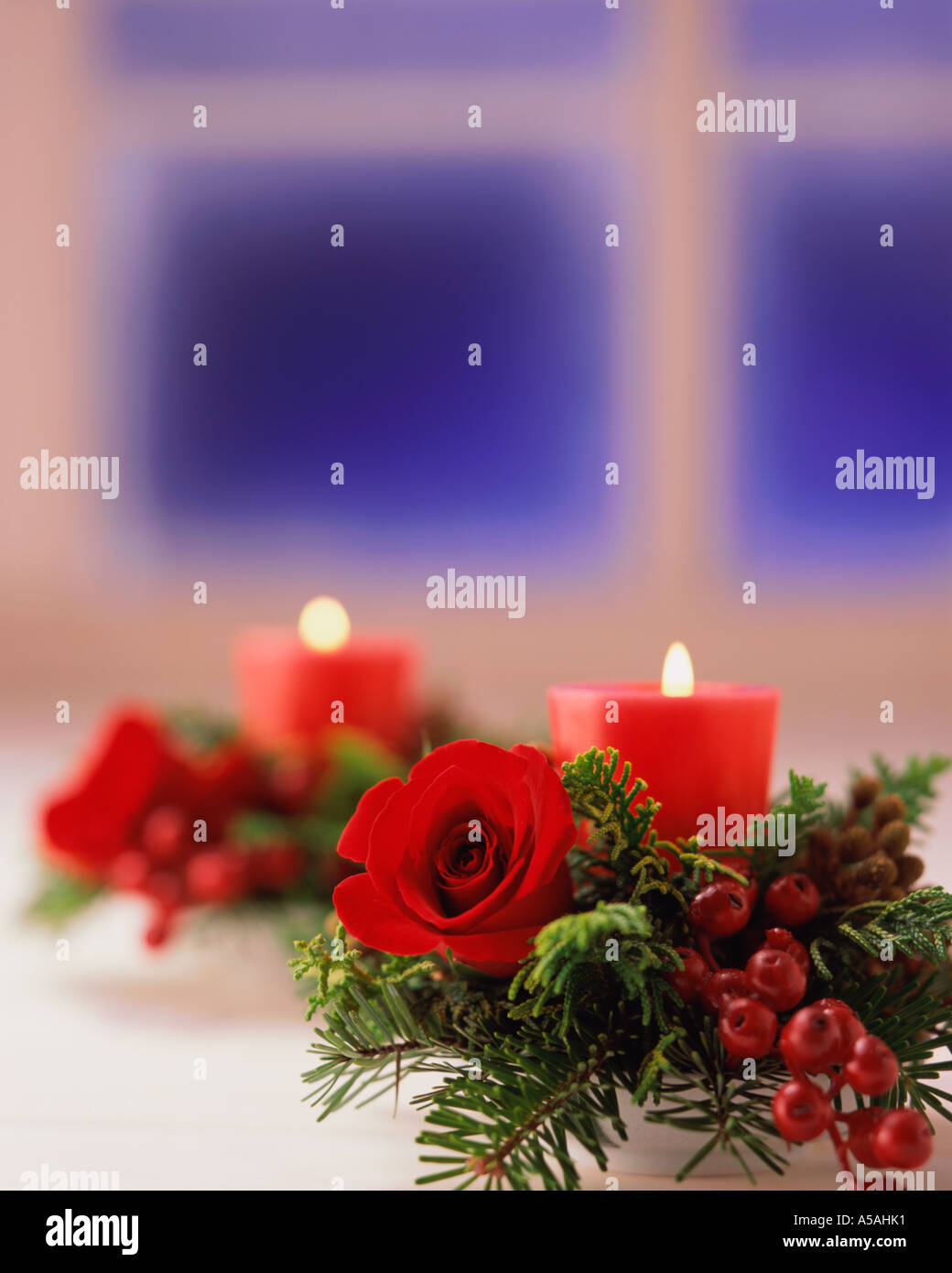 Candle with red rose Stock Photo - Alamy