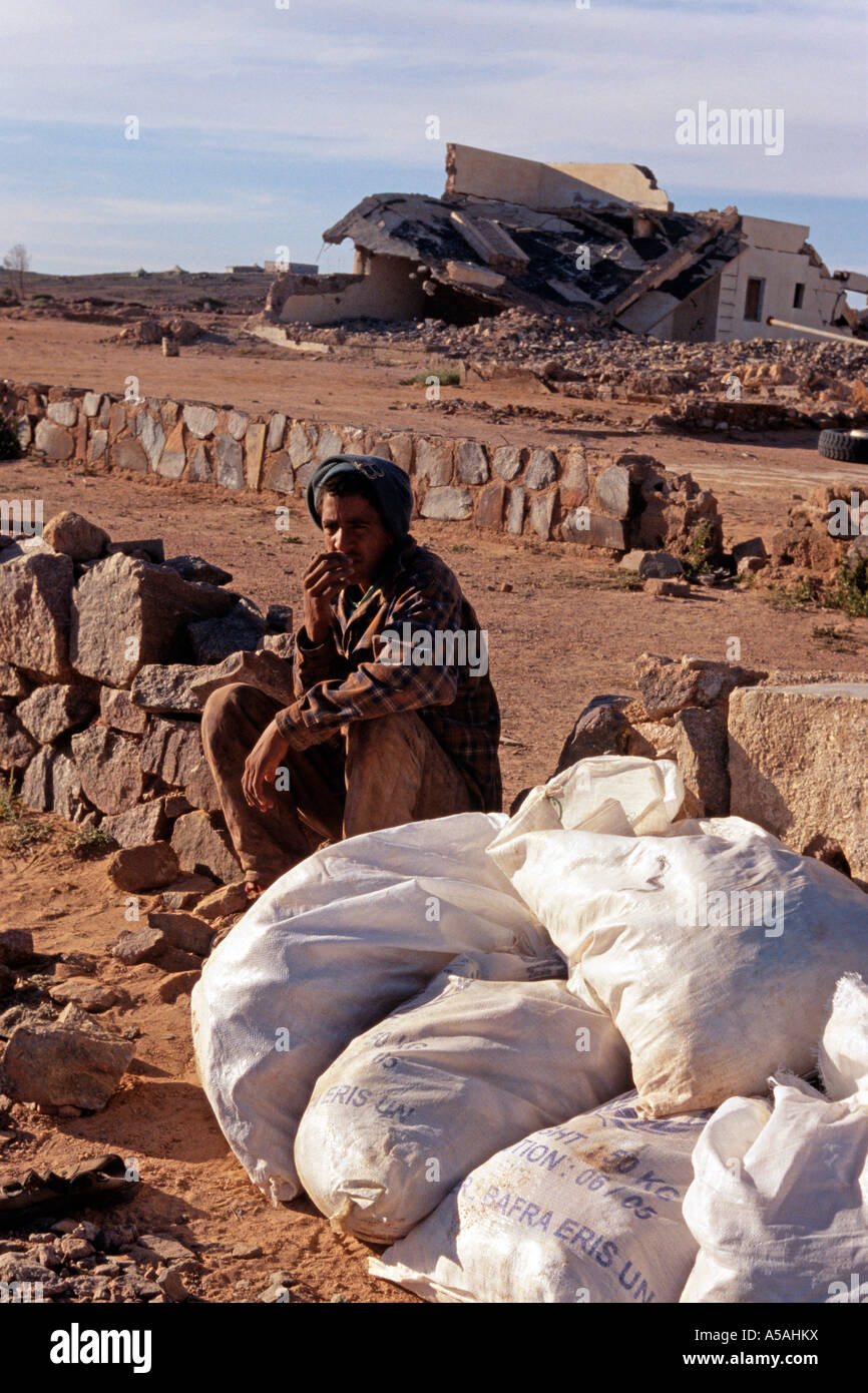 A Sahrawi man sitting on the side of a road in Tindouf Western Algeria ...