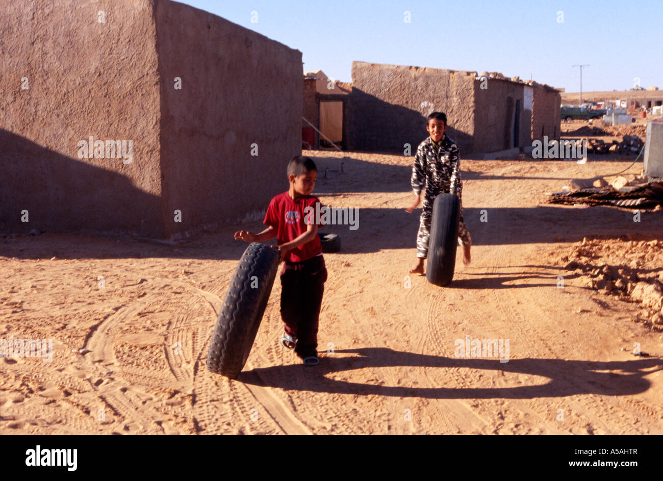 Sahrawi children playing with rubber tyres in Tindouf Western Algeria ...