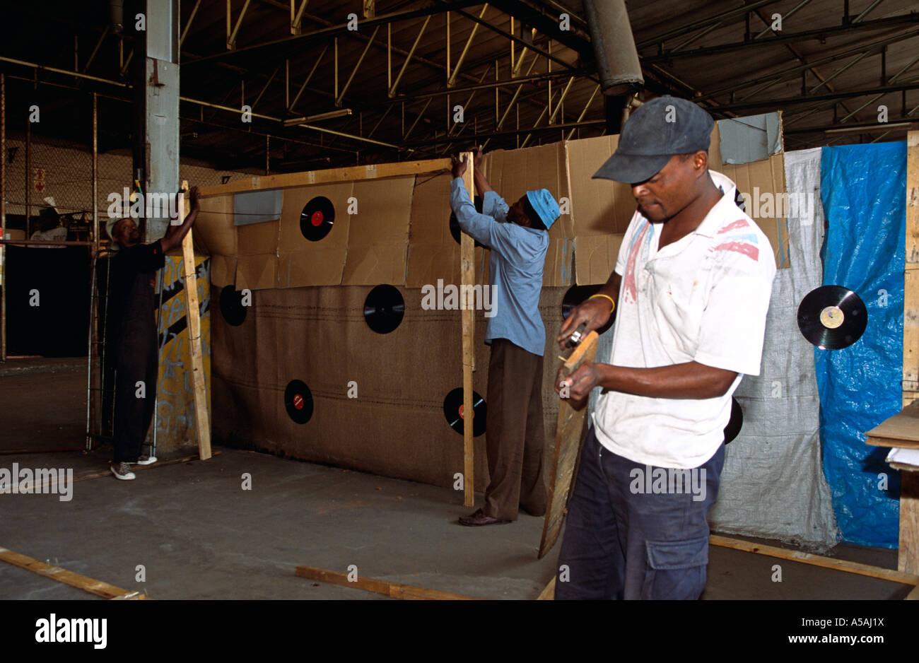 A group of men repairing their shacks in Johannesburg South Africa ...