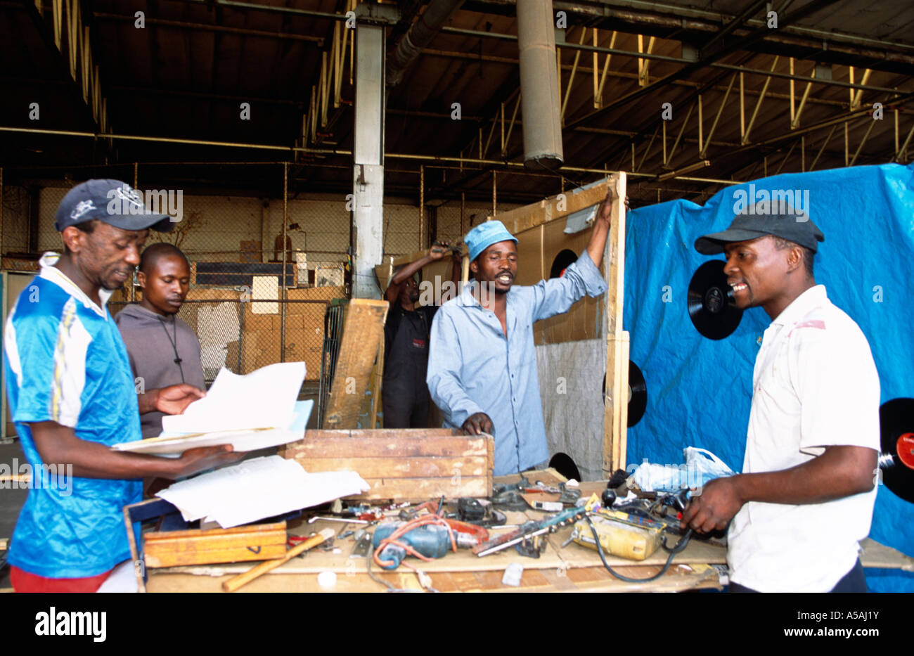 A group of men repairing their shacks in Johannesburg South Africa ...