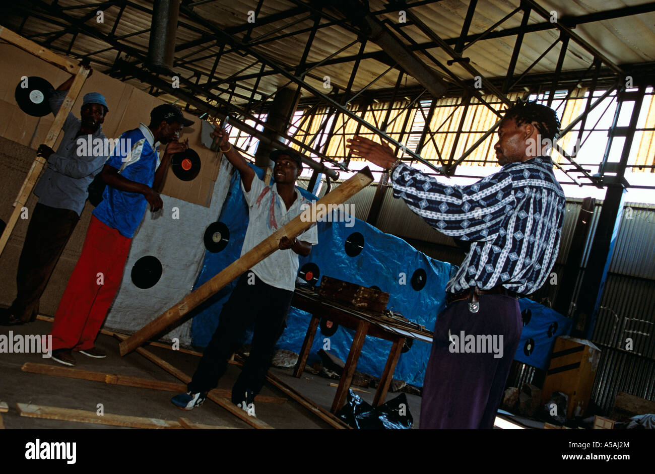 A group of men repairing their shacks in Johannesburg South Africa ...