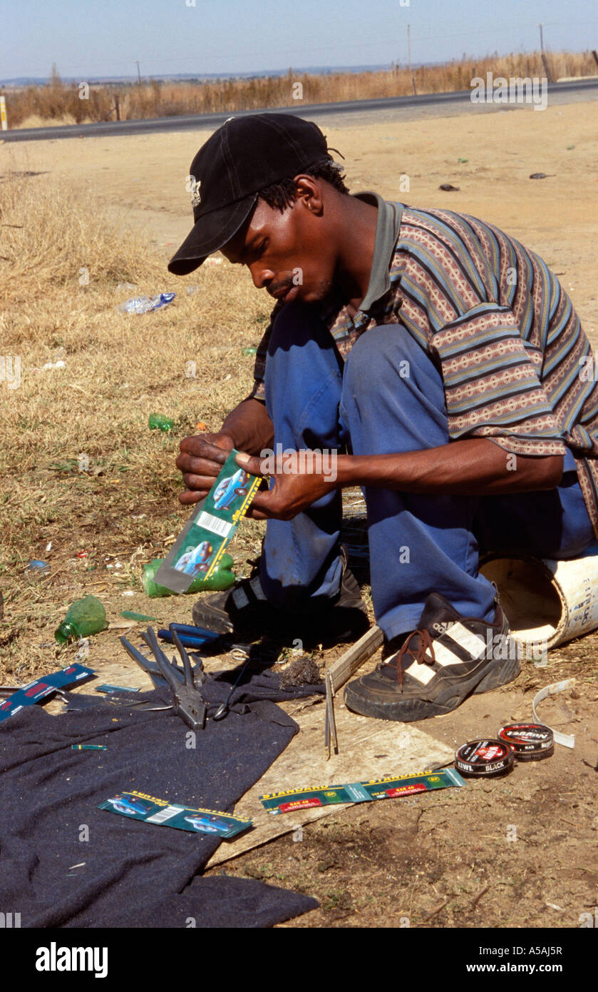 An African man sitting with various tools in Soweto South Africa Stock ...